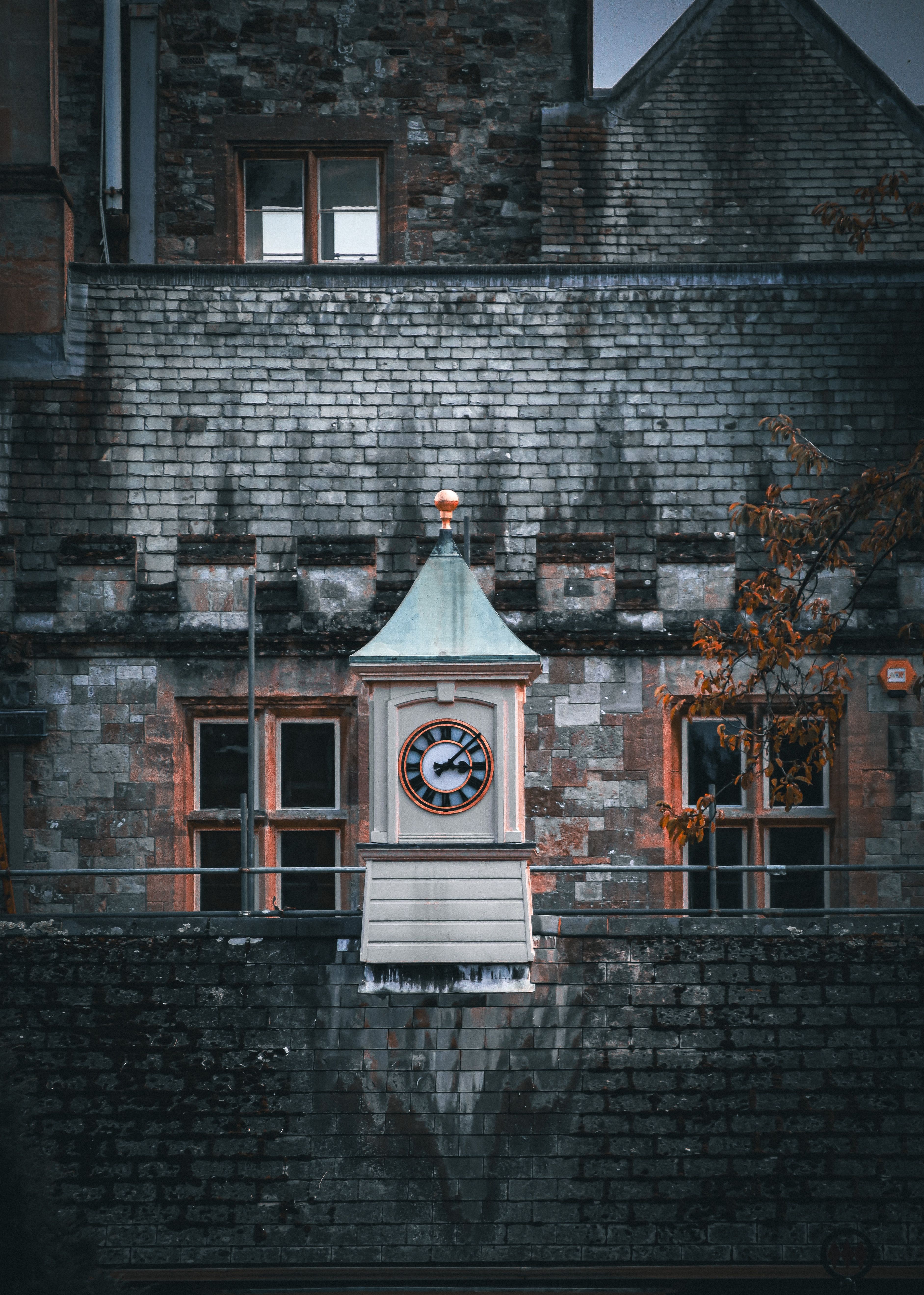 Clock Tower on Building Wall · Free Stock Photo