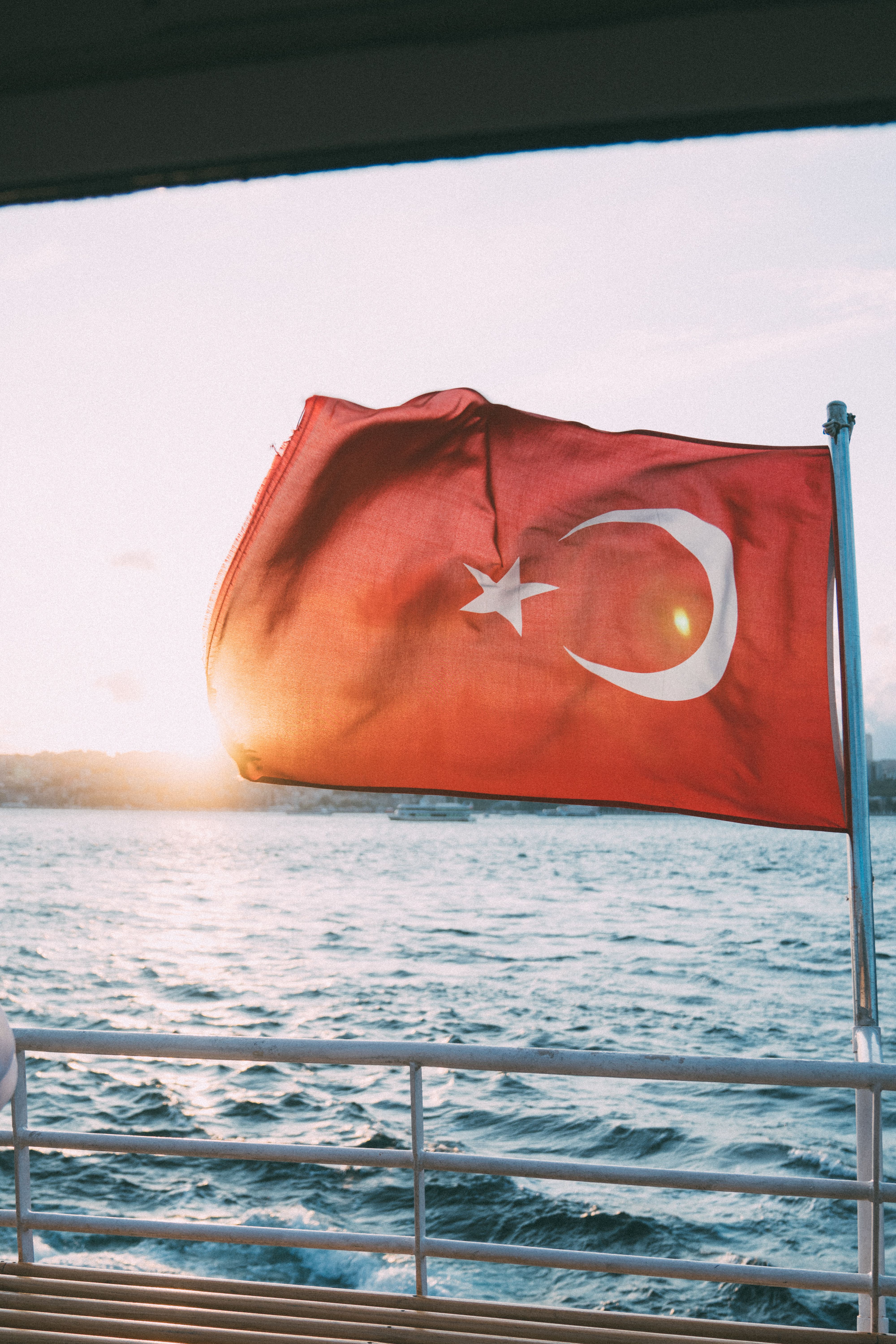 Flag of Turkey Flying on a Sea Ship Deck · Free Stock Photo
