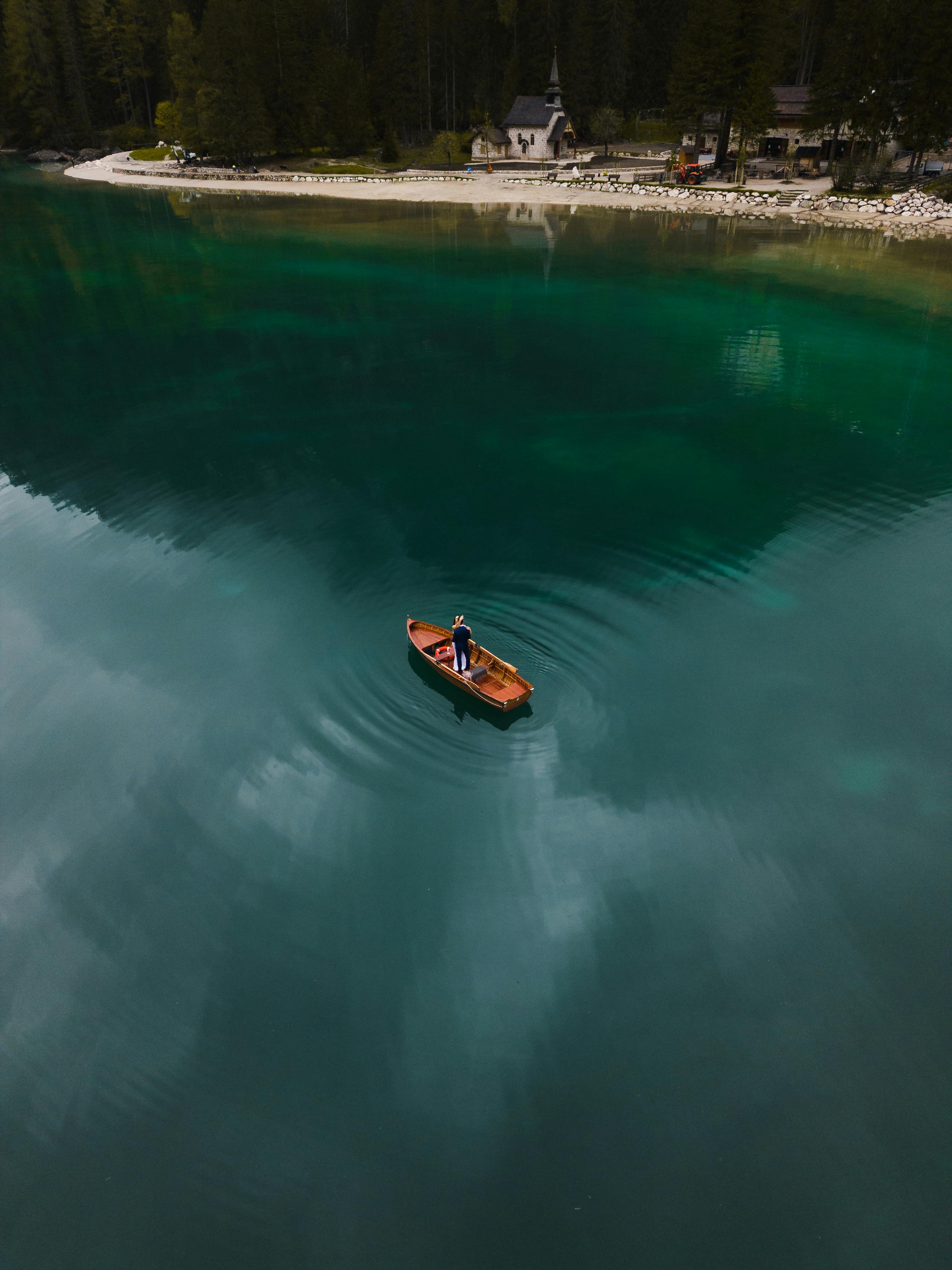 High Angle Shot Of People Rowing Boat · Free Stock Photo