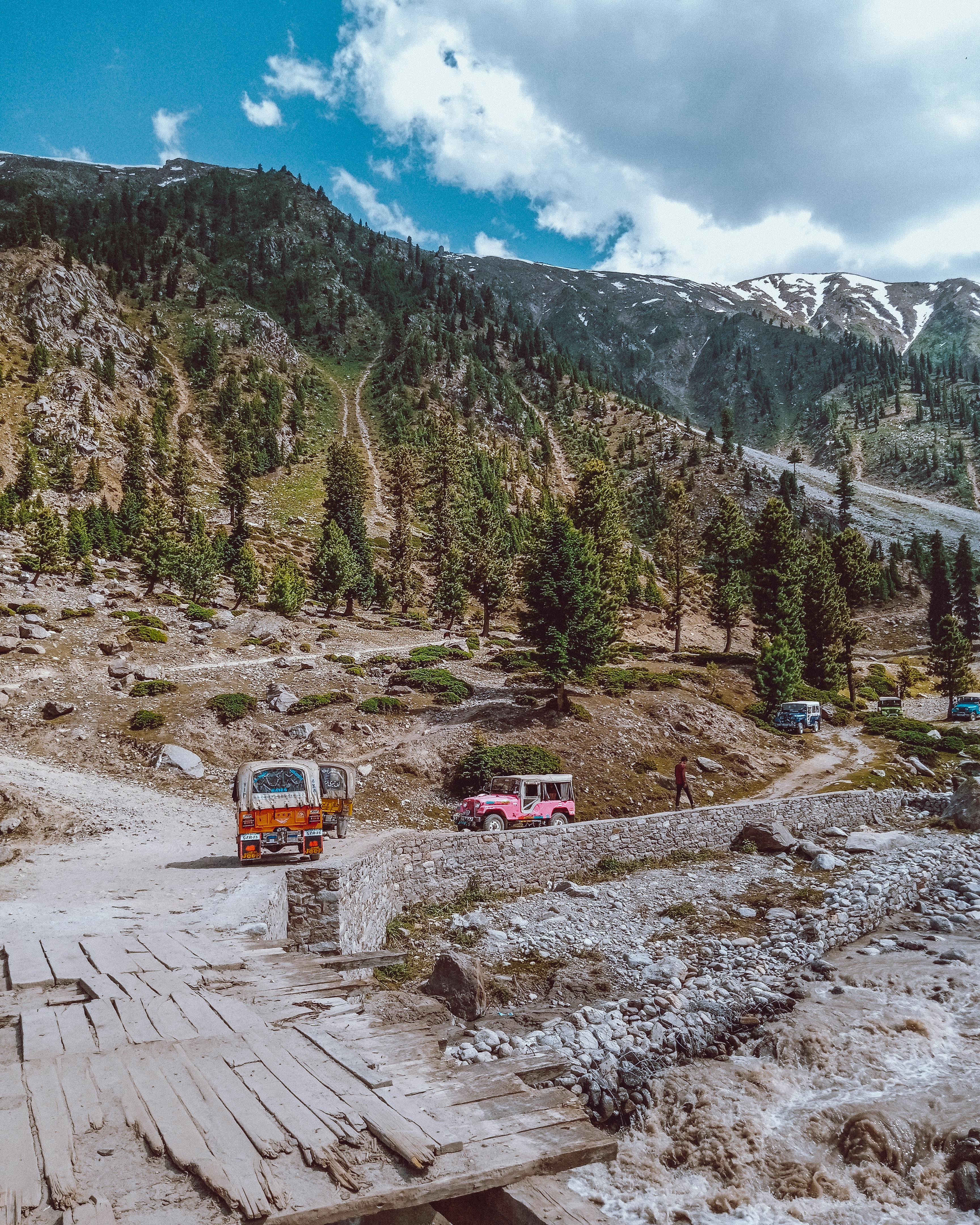 Cars on a Trail in Mountains · Free Stock Photo