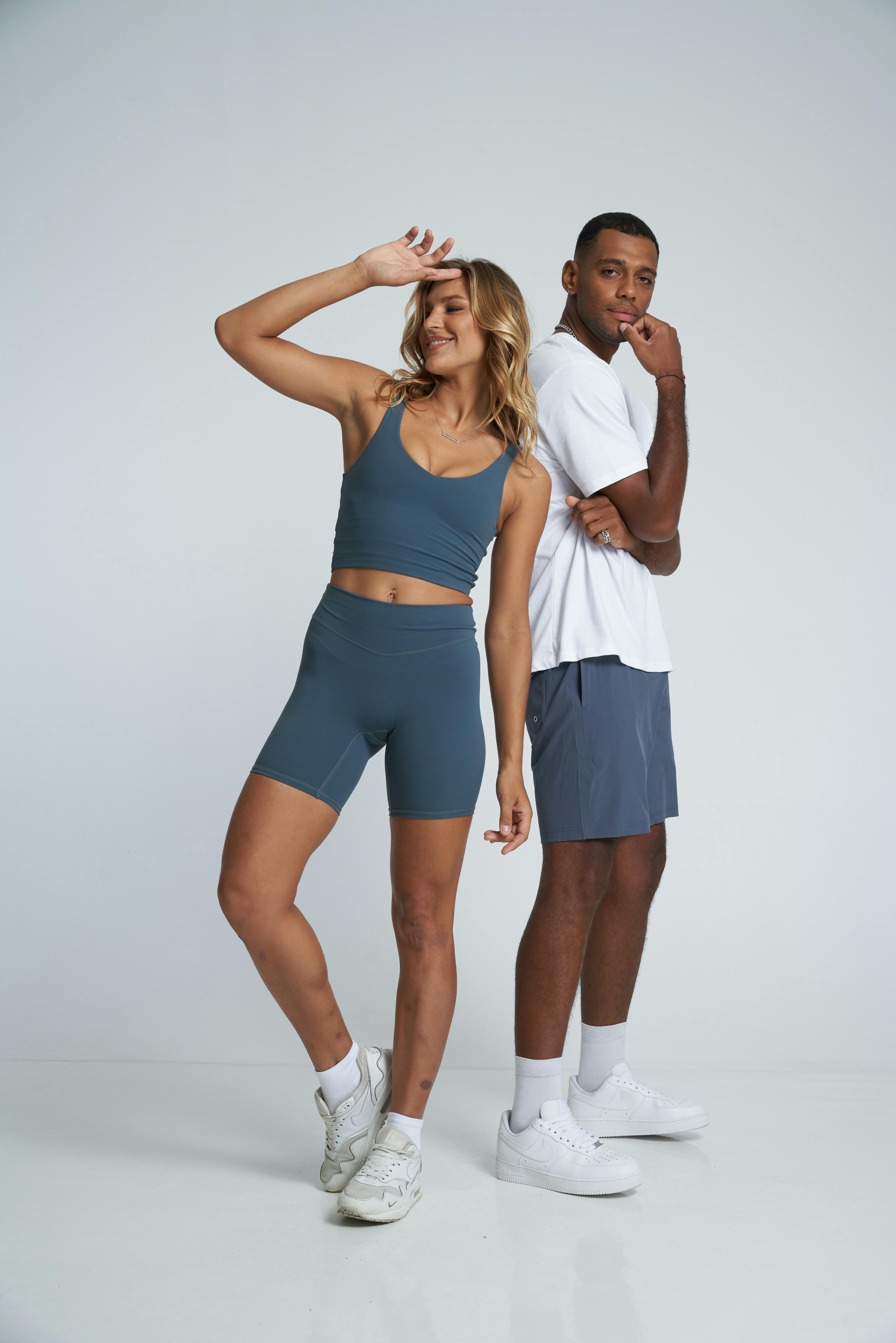 Woman and Man Posing in Gym Clothing · Free Stock Photo