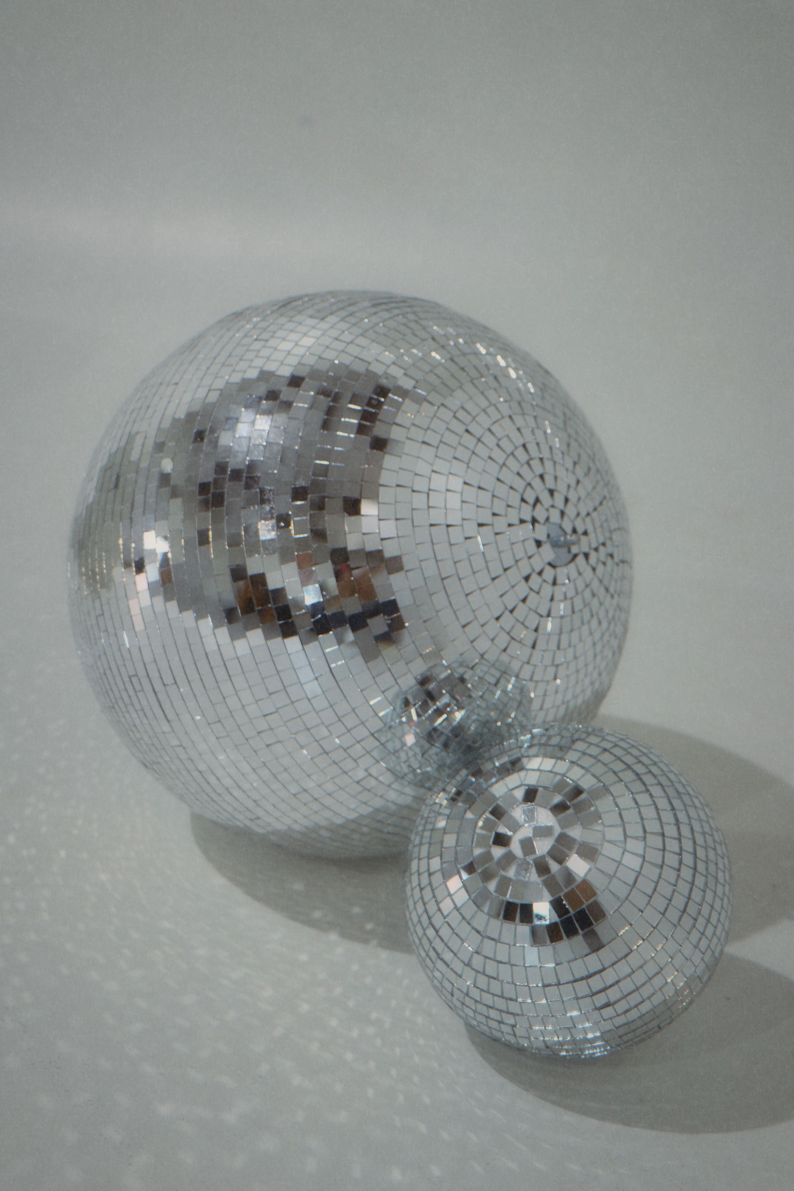 Person Holding a Disco Ball · Free Stock Photo