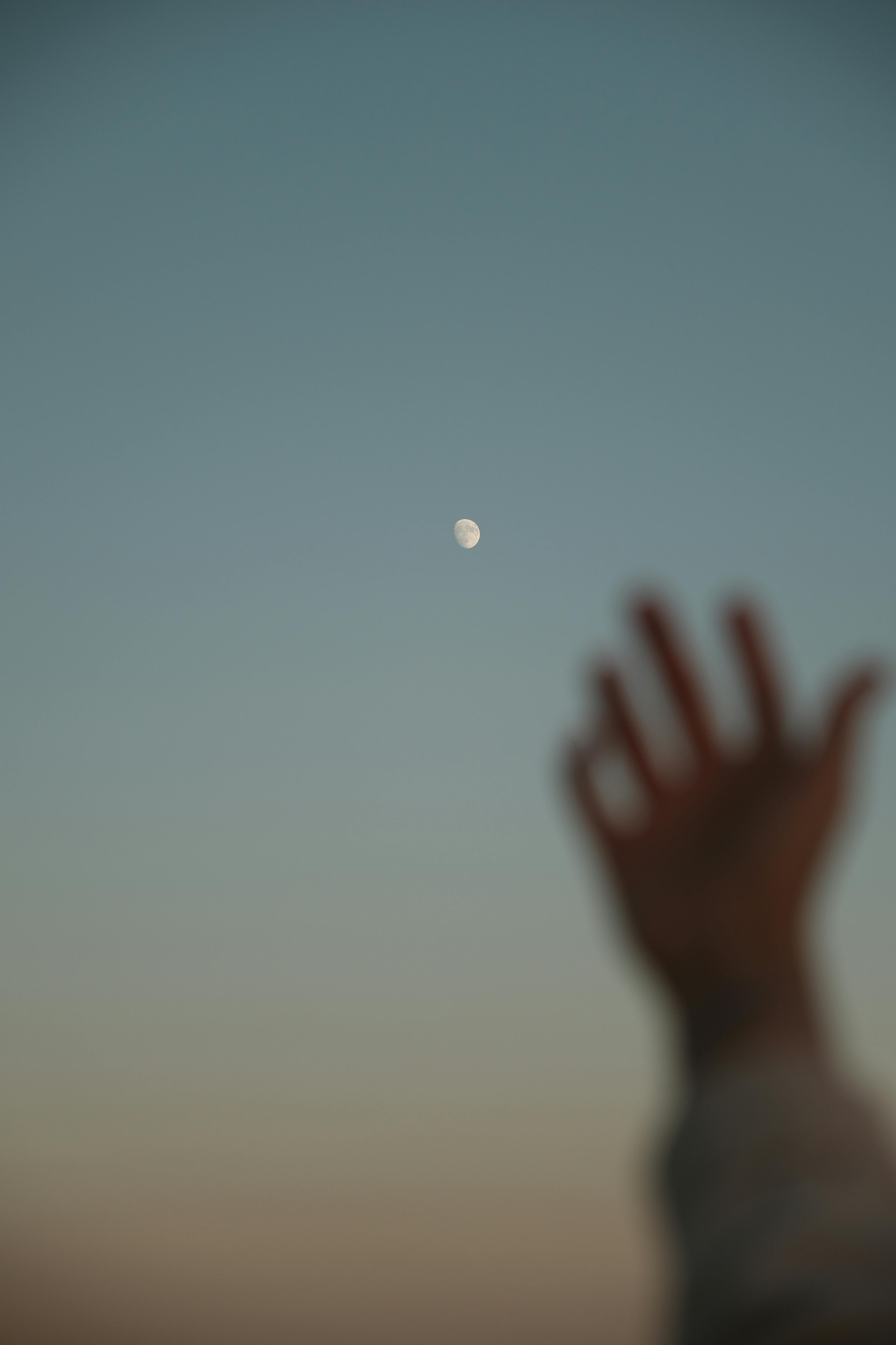 Hand under Moon on Clear, Sunset Sky · Free Stock Photo