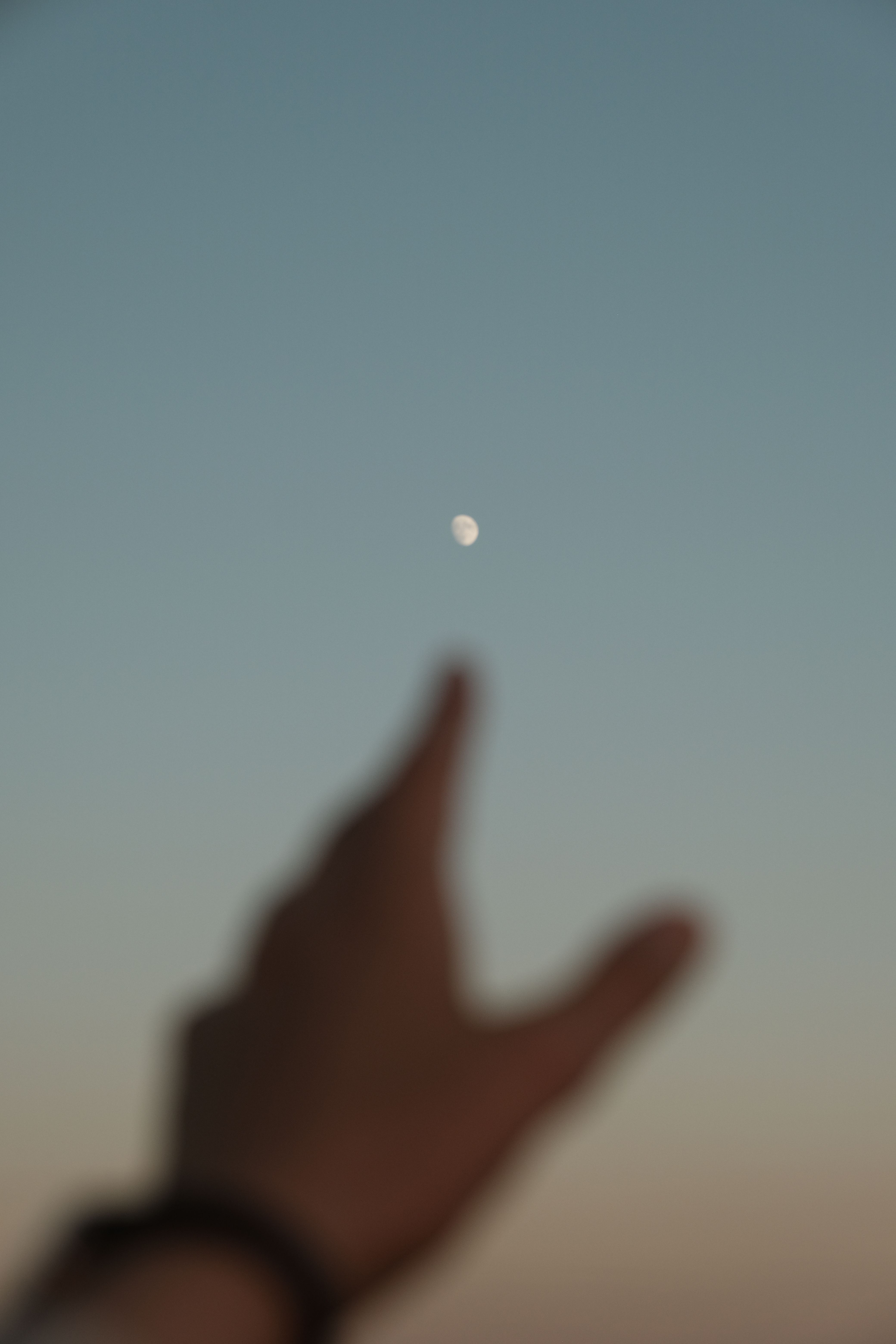 Moon over Hand at Sunset · Free Stock Photo