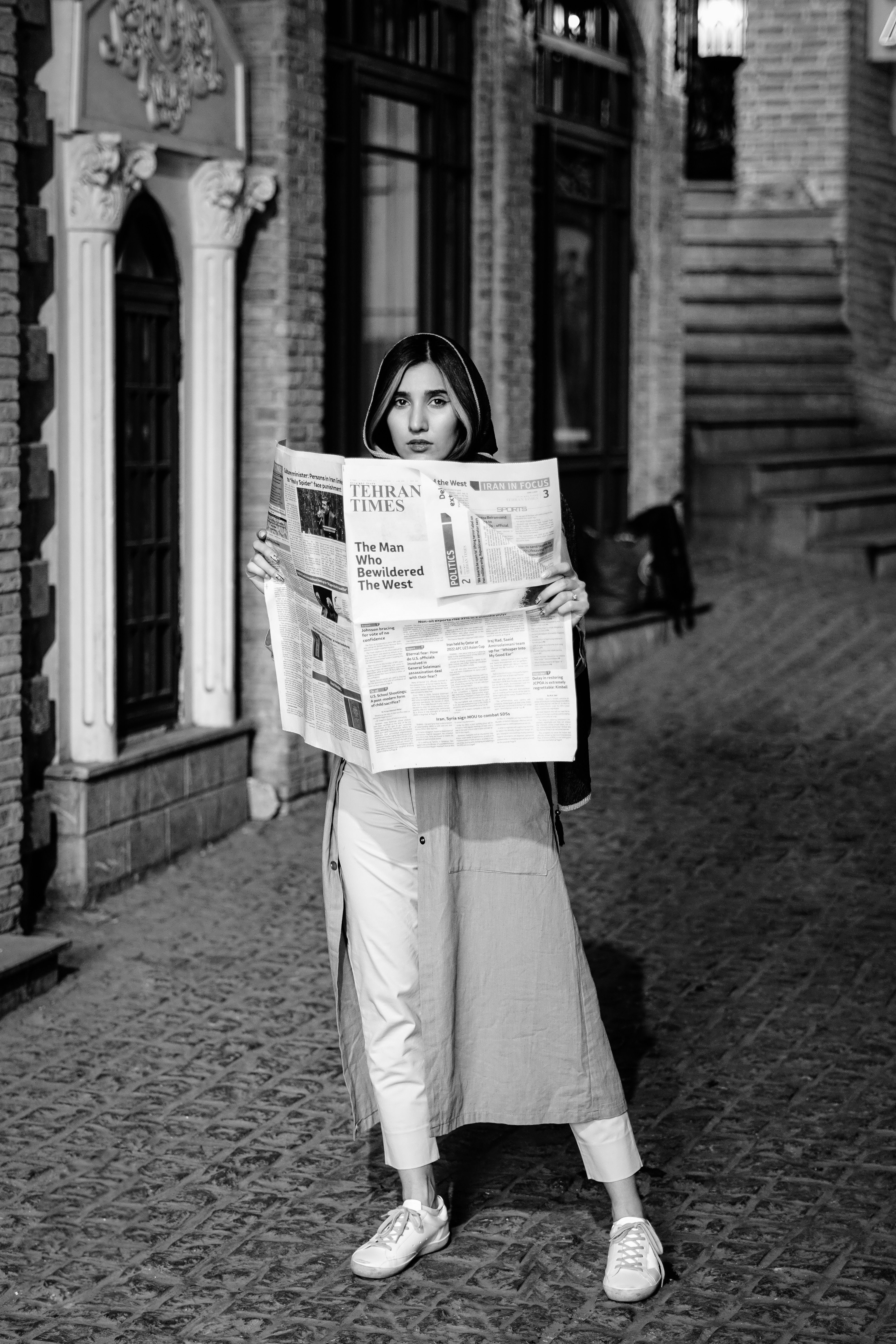 Woman Posing with Newspaper on Street · Free Stock Photo