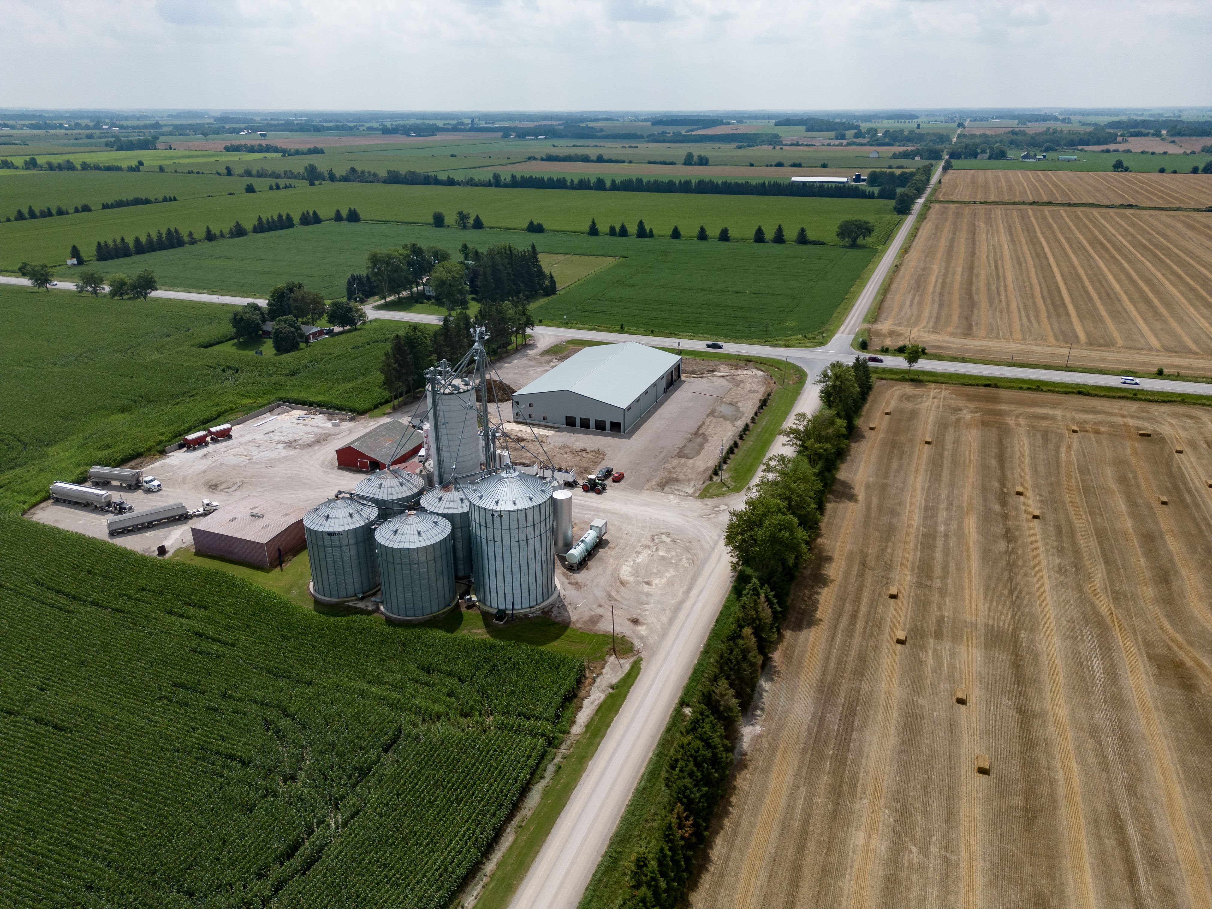 An aerial view of a farm with grain silos · Free Stock Photo