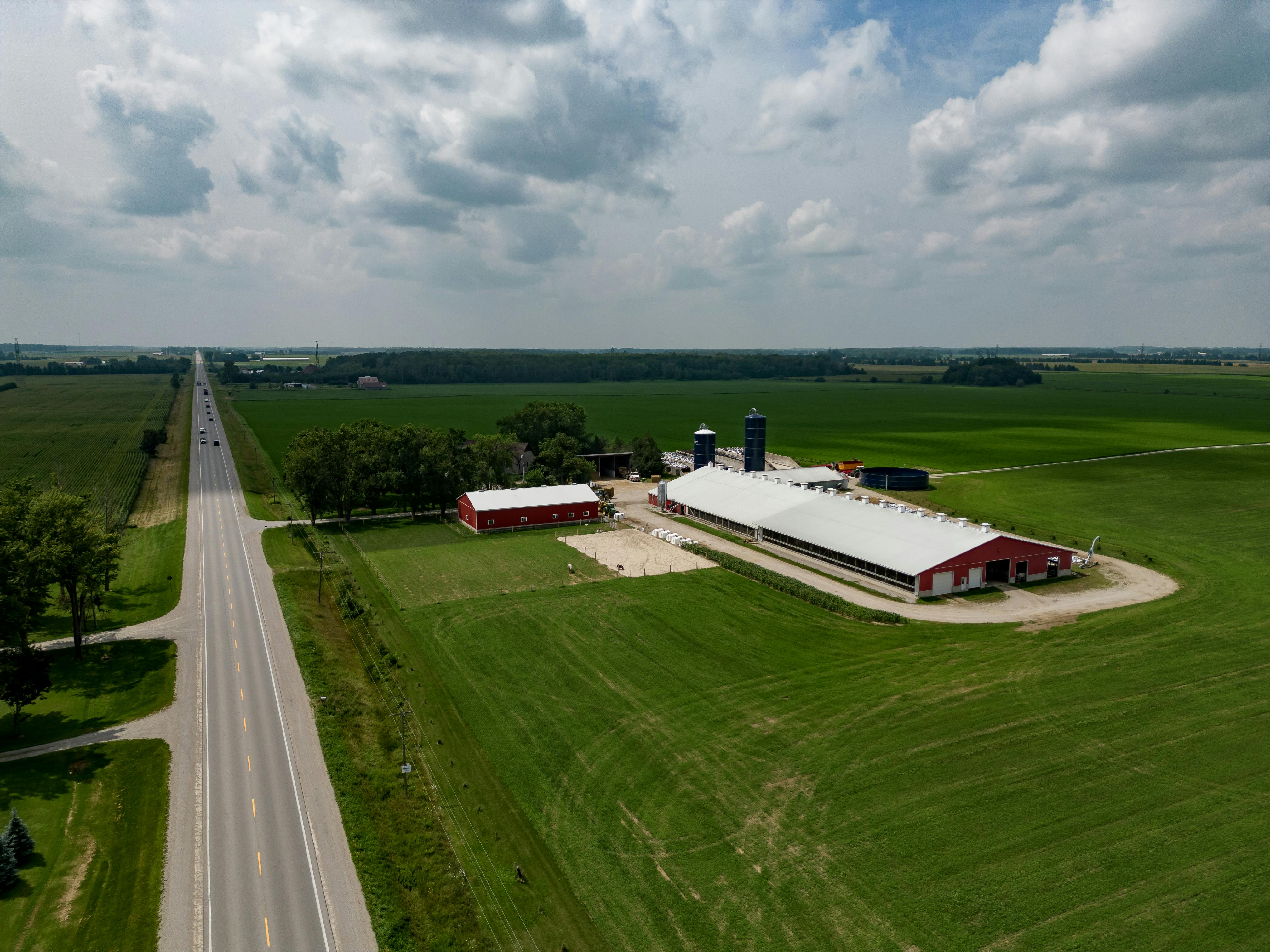 Aerial View of a Farm and a Road · Free Stock Photo