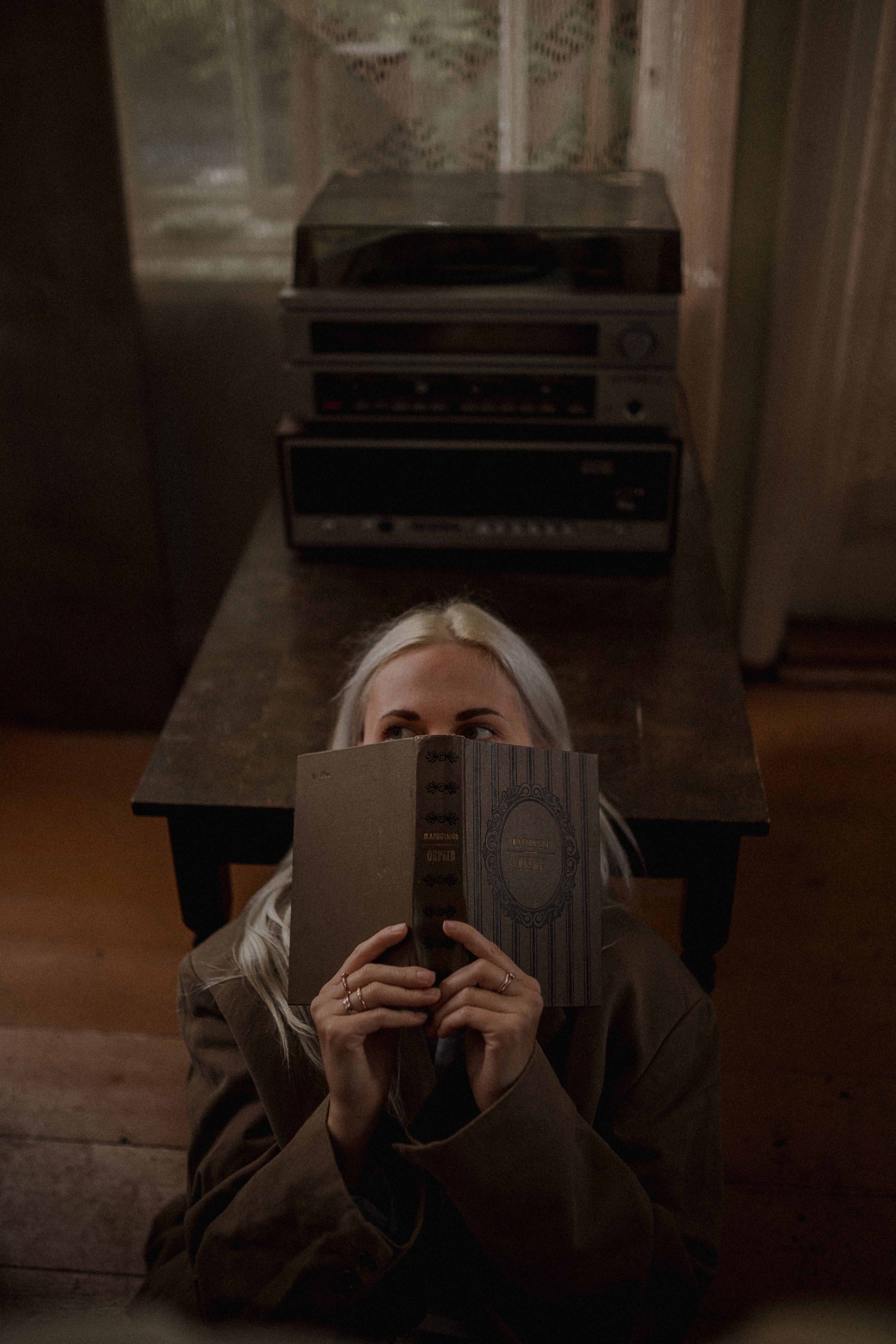 Woman Holding Book on Face · Free Stock Photo
