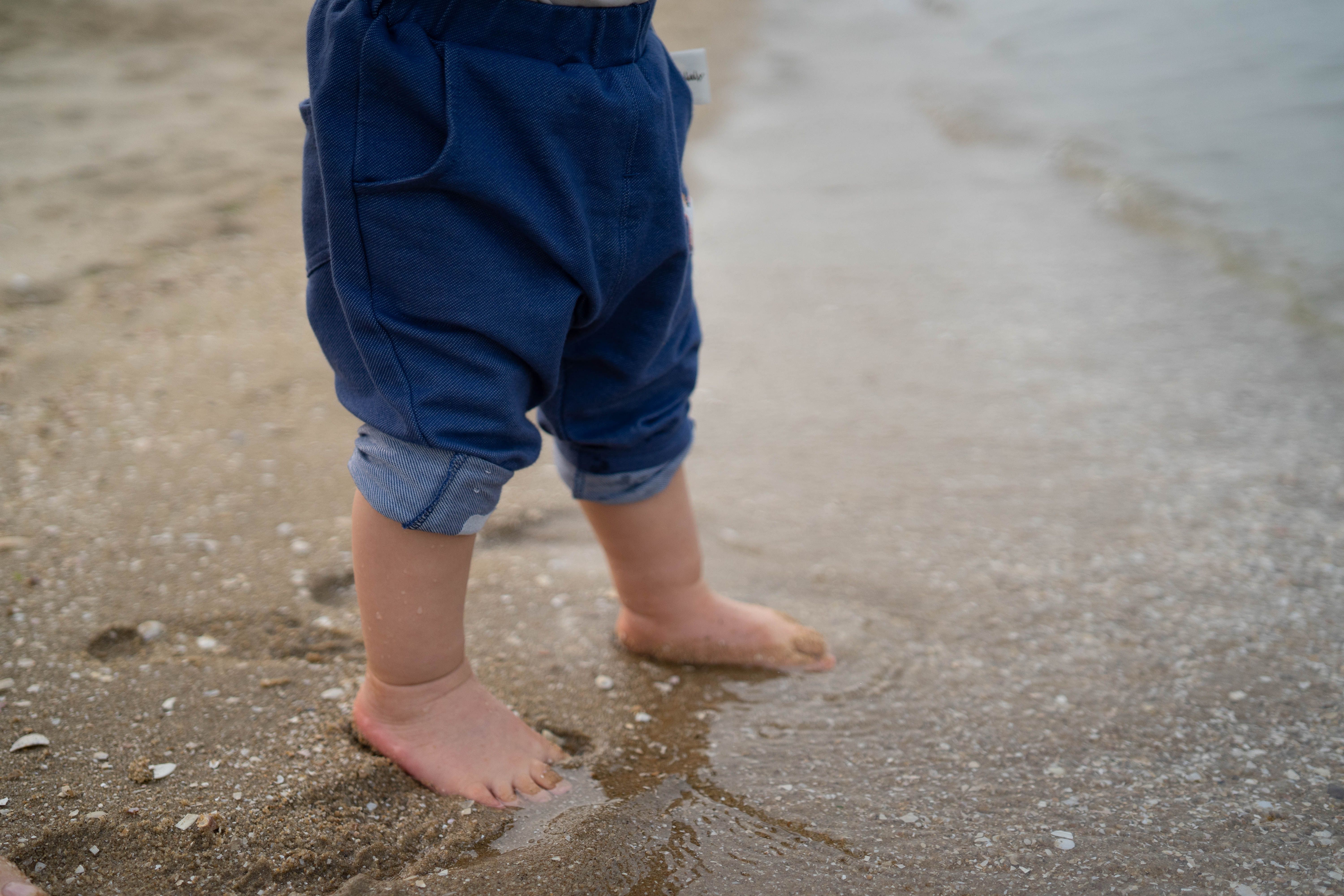 Kid Legs on Beach in Sea · Free Stock Photo