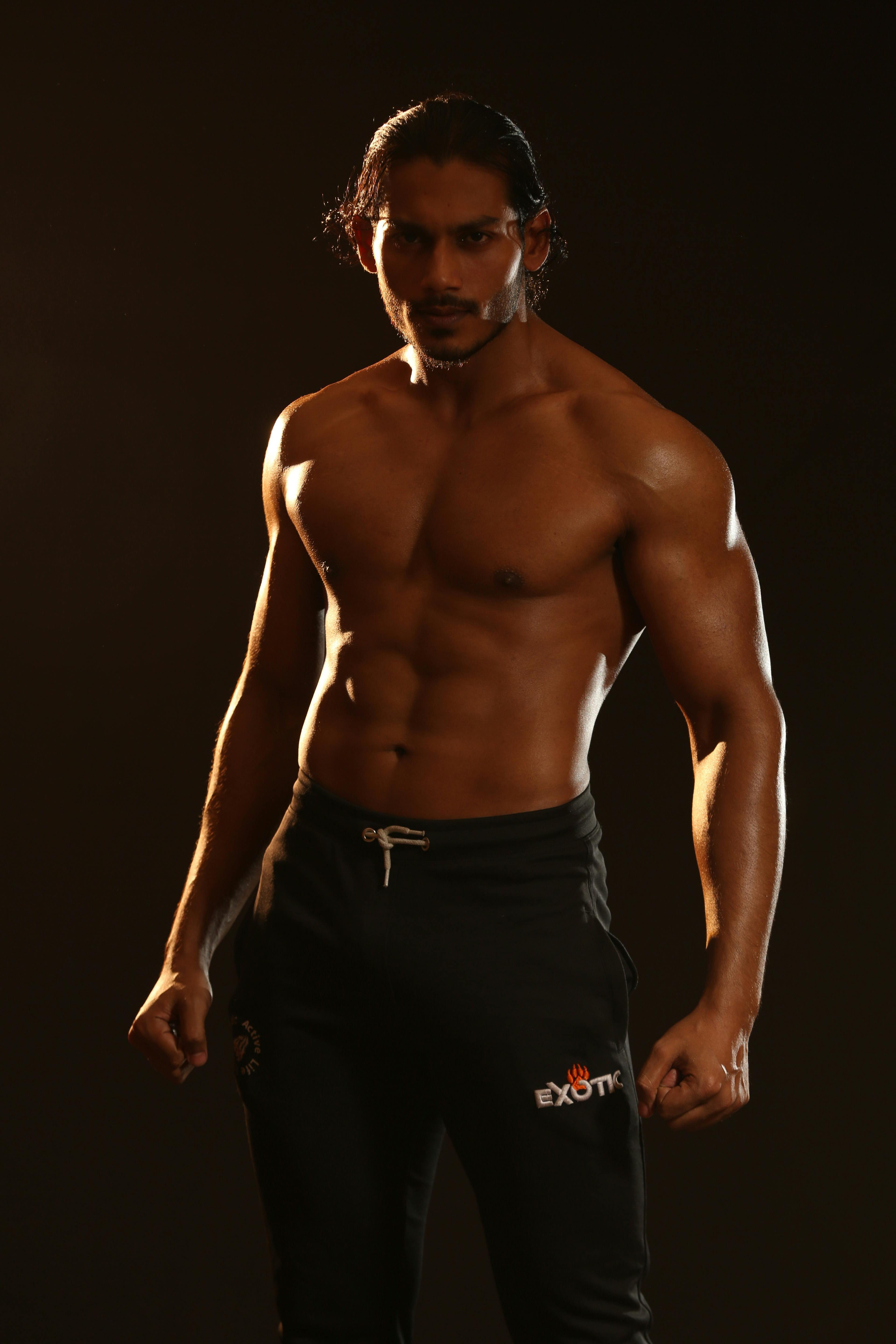 A man in black pants and a shirt posing · Free Stock Photo