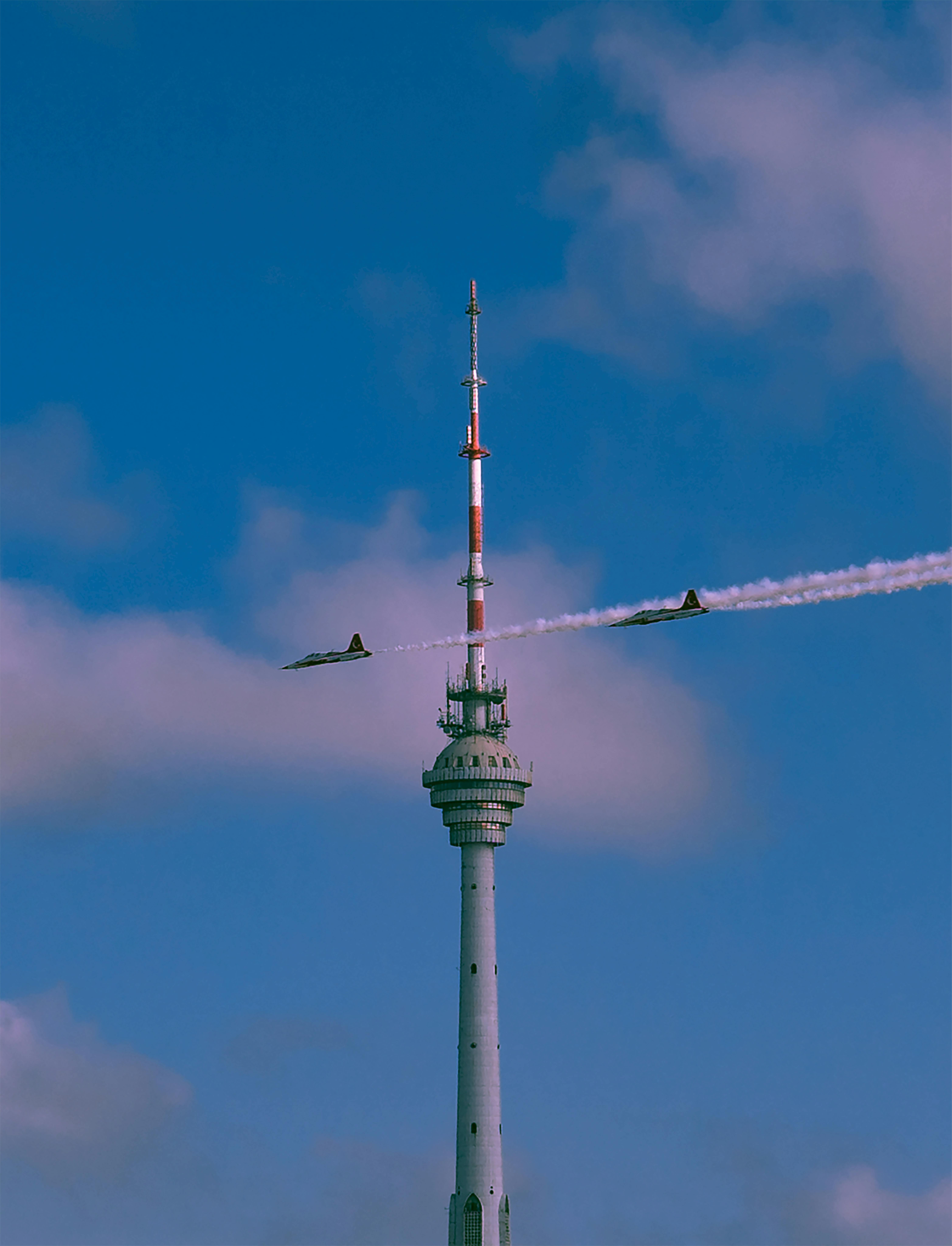 Military Airplanes Flying over Broadcast Tower · Free Stock Photo