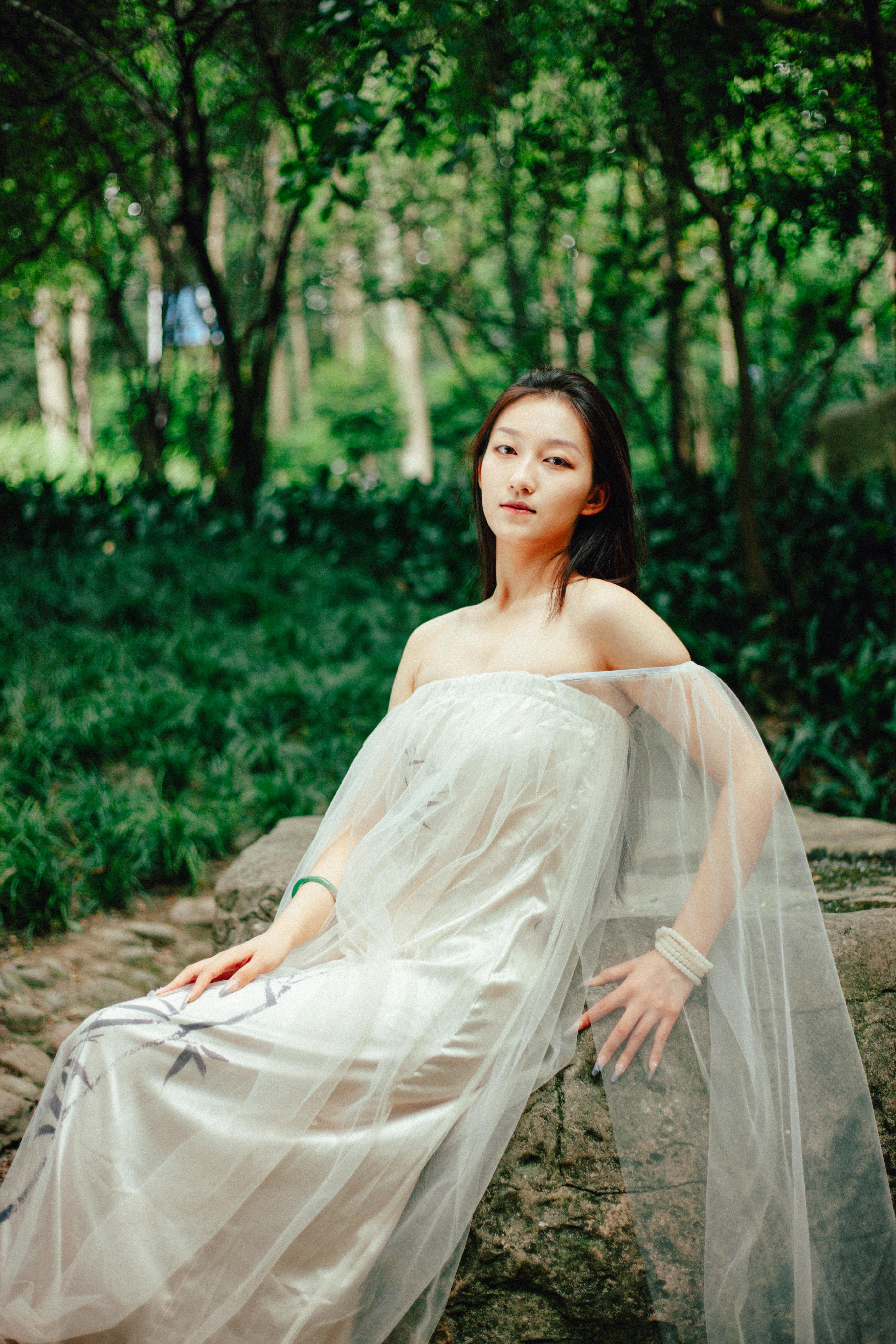 A Woman Sitting on the Tree Log · Free Stock Photo