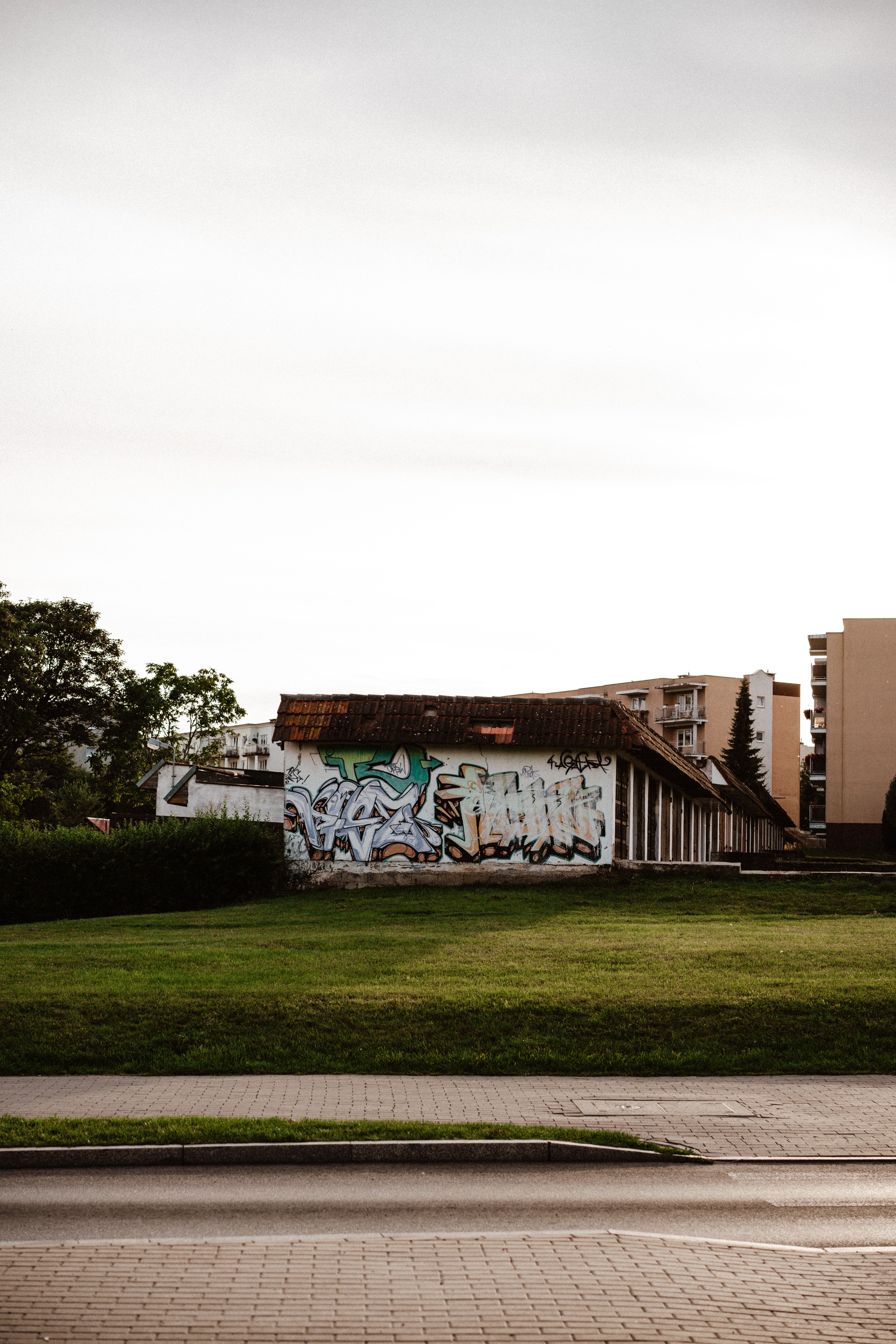 Graffiti on Wall of Building with Garages · Free Stock Photo