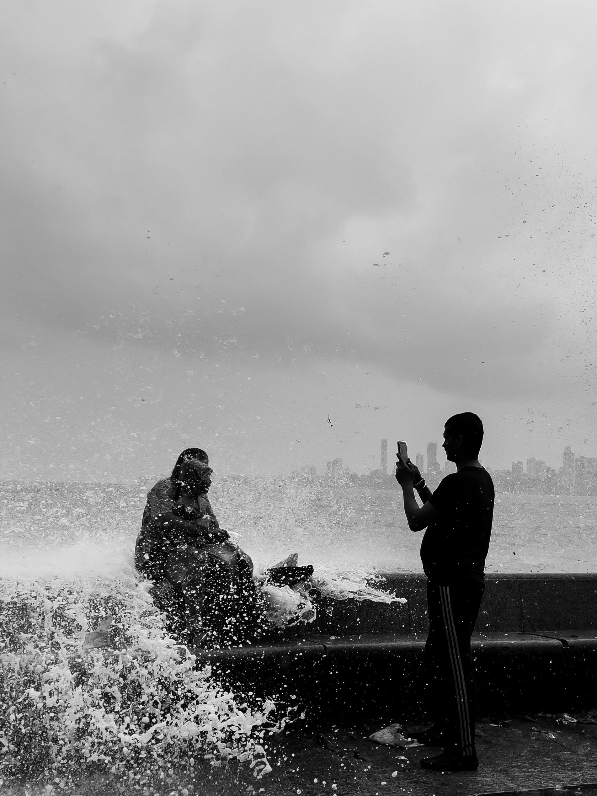 Man Walking Near Body of Water · Free Stock Photo