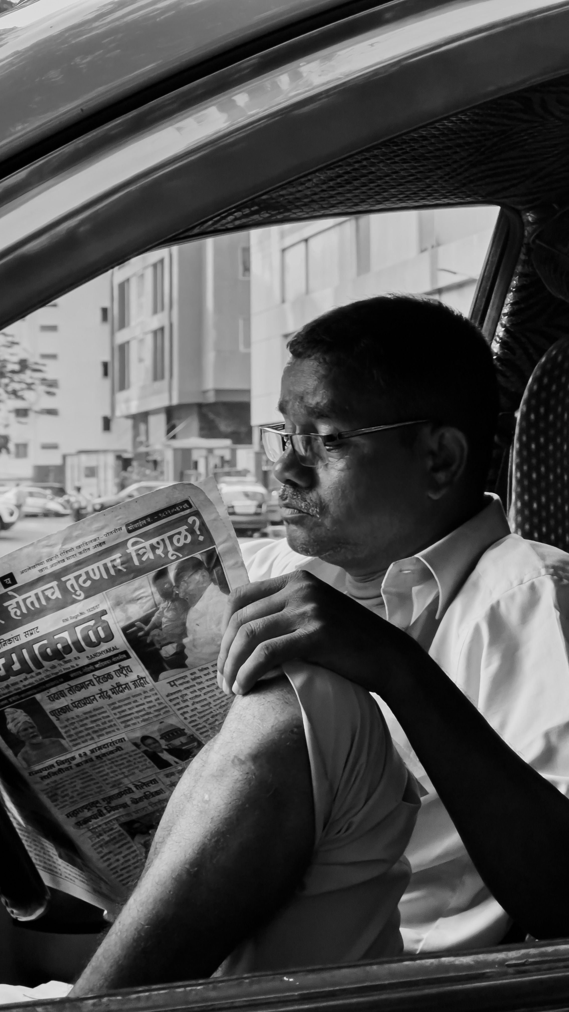 Man Reading Newspaper in Car · Free Stock Photo