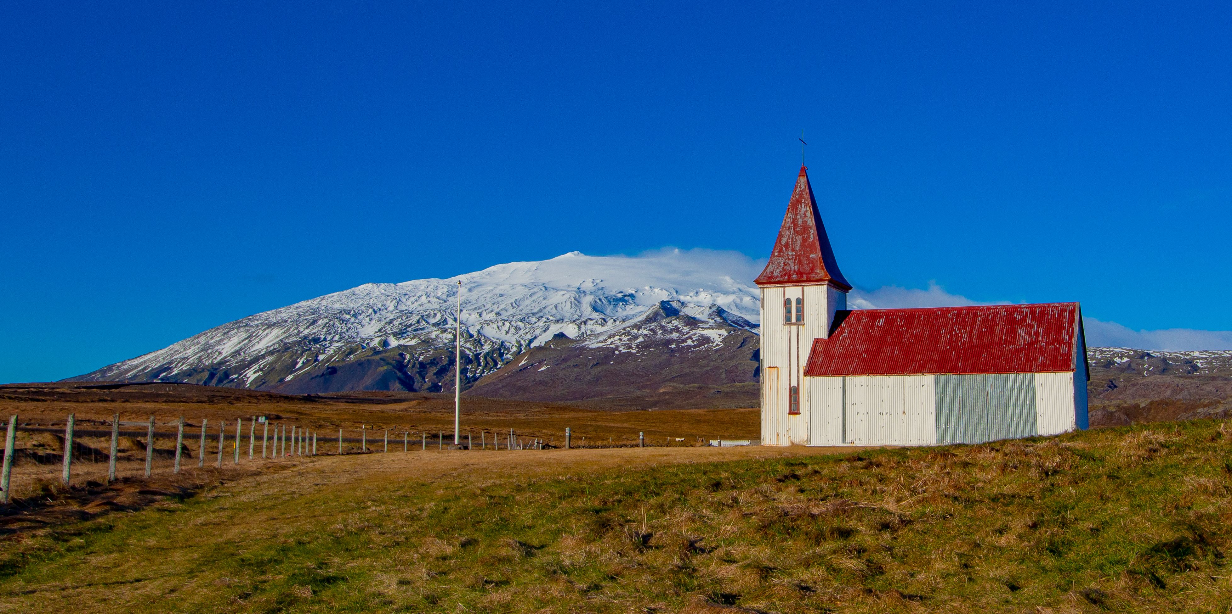 View of the Hellnar Church and a Snowcapped Mountain in the Background ...