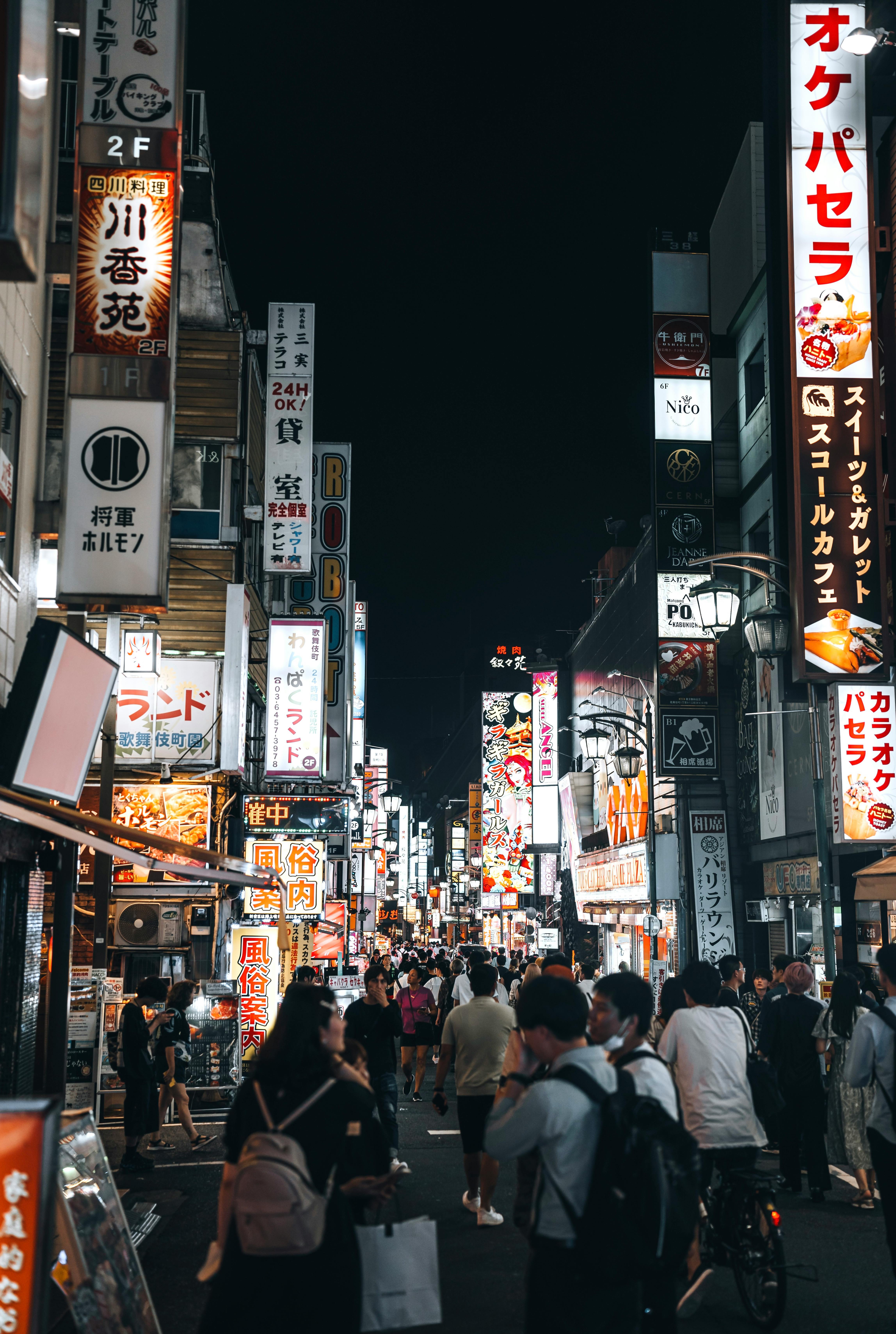 People Walking On The Streets Surrounded By Buildings · Free Stock Photo