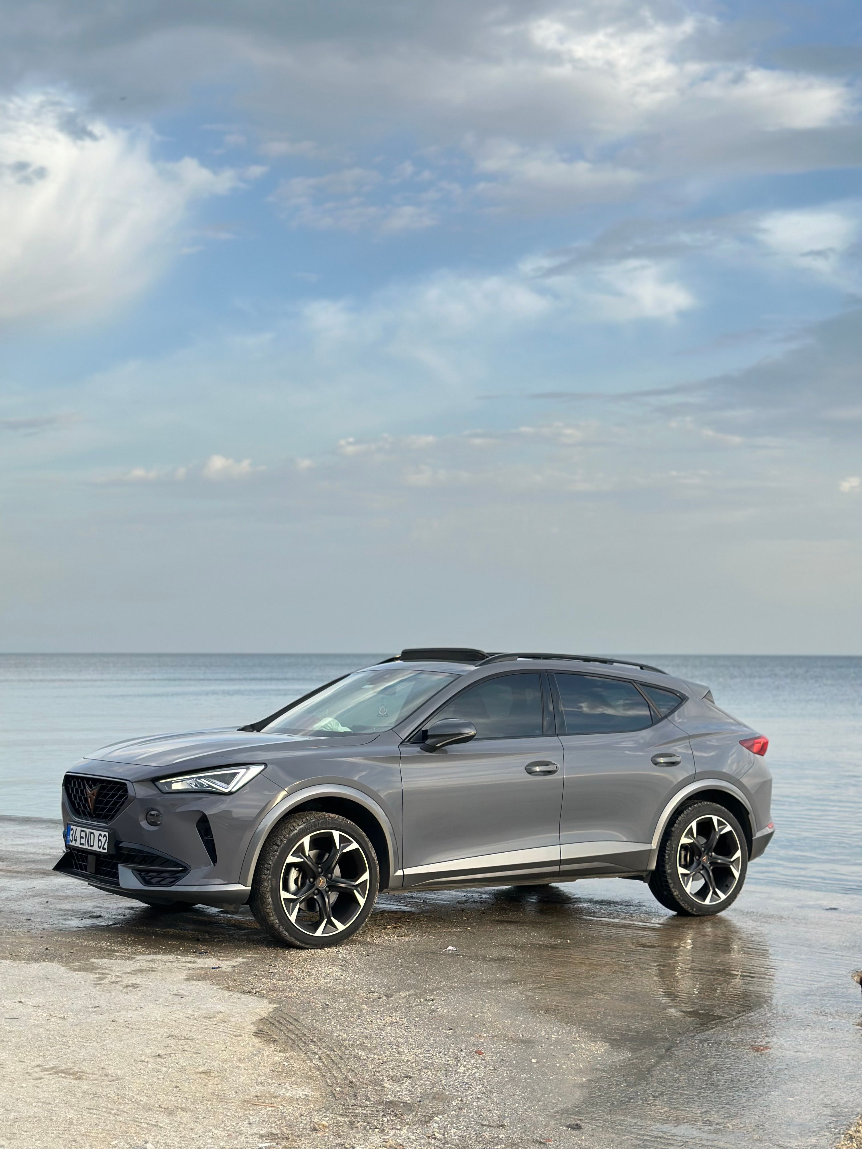 View of a Cupra Formentor Parked on a Beach · Free Stock Photo