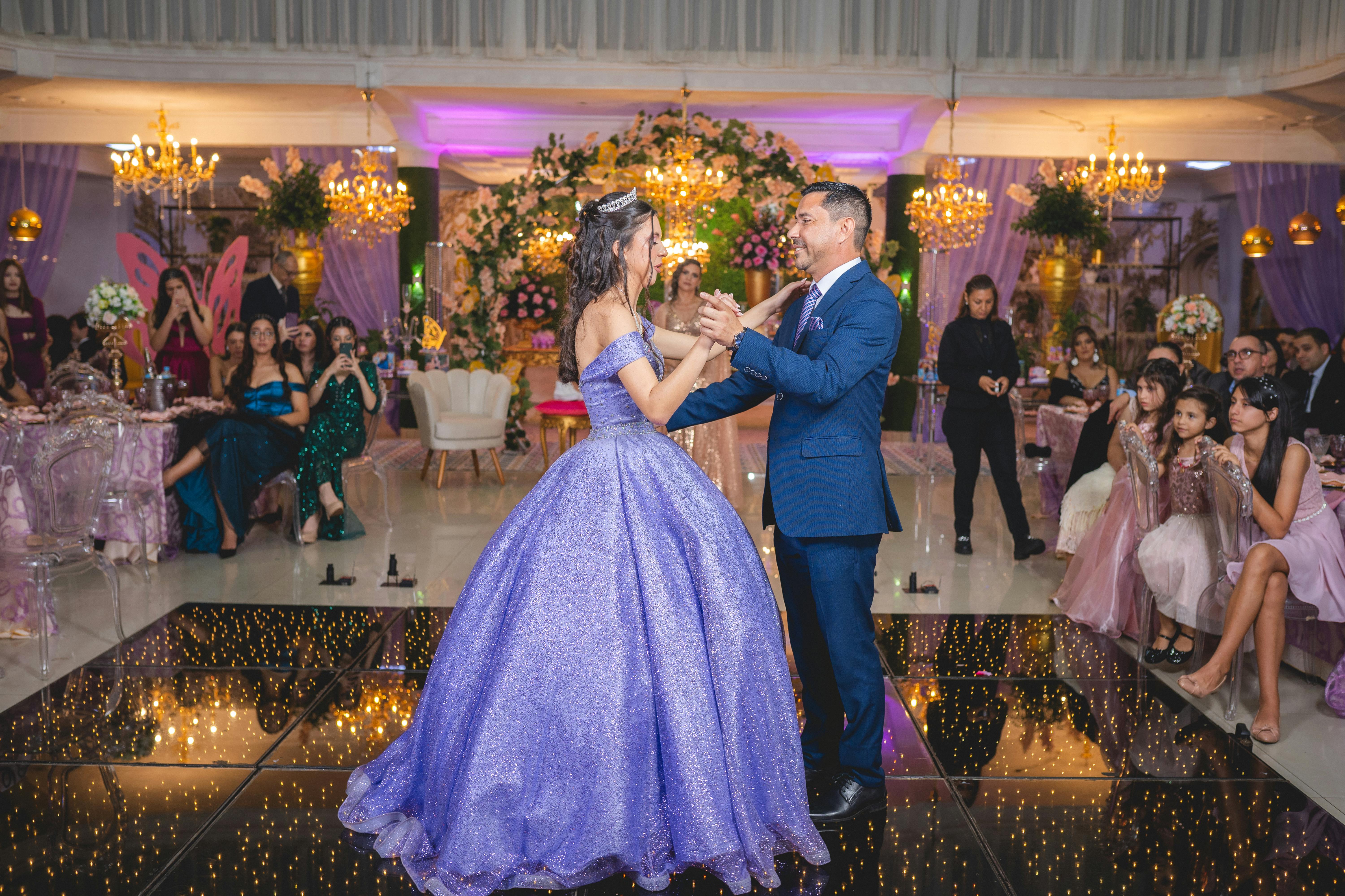 Quinceañera Dancing Waltz with her Father · Free Stock Photo