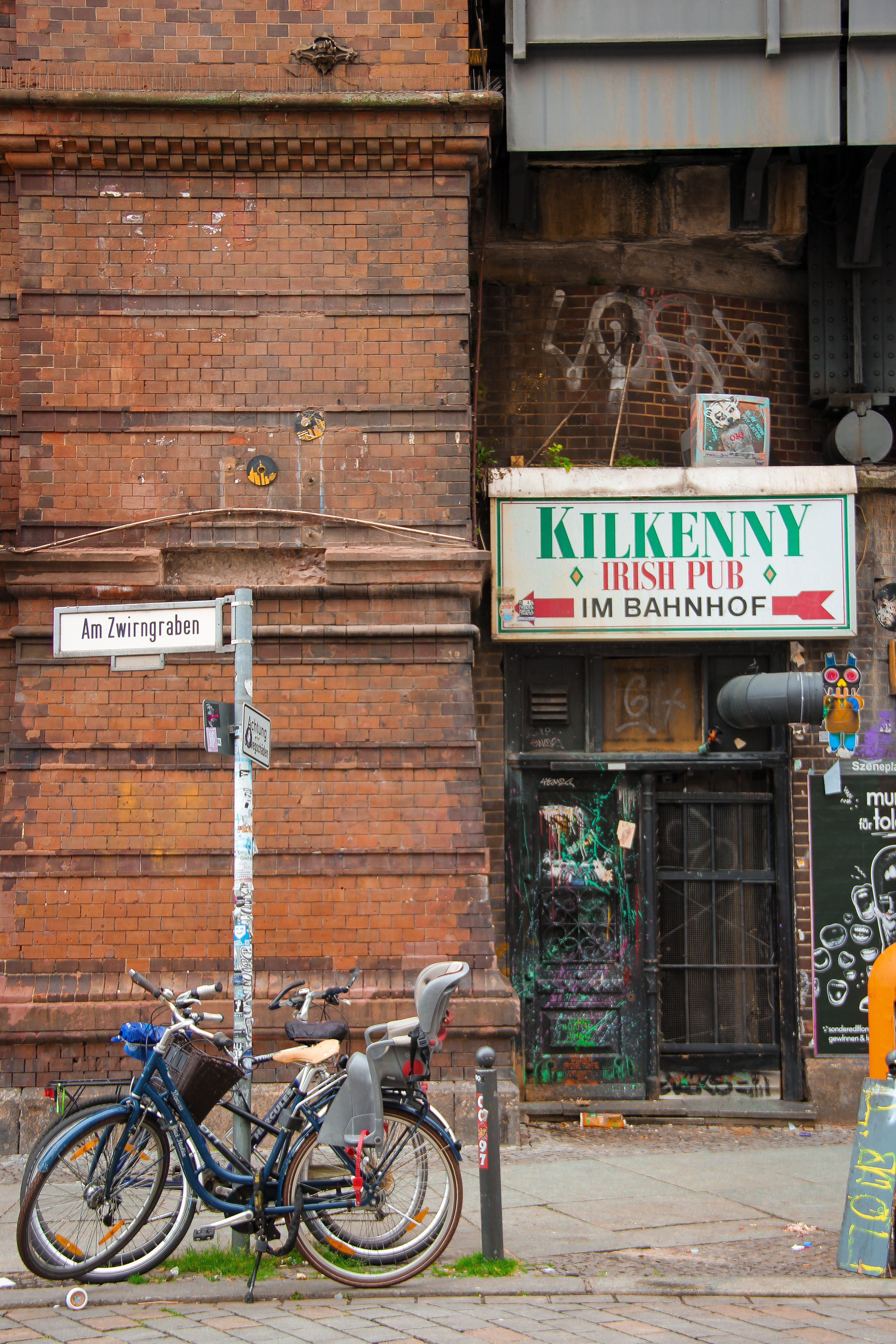View of Bicycles on a Sidewalk in front of the Kilkenny Irish Pub in ...