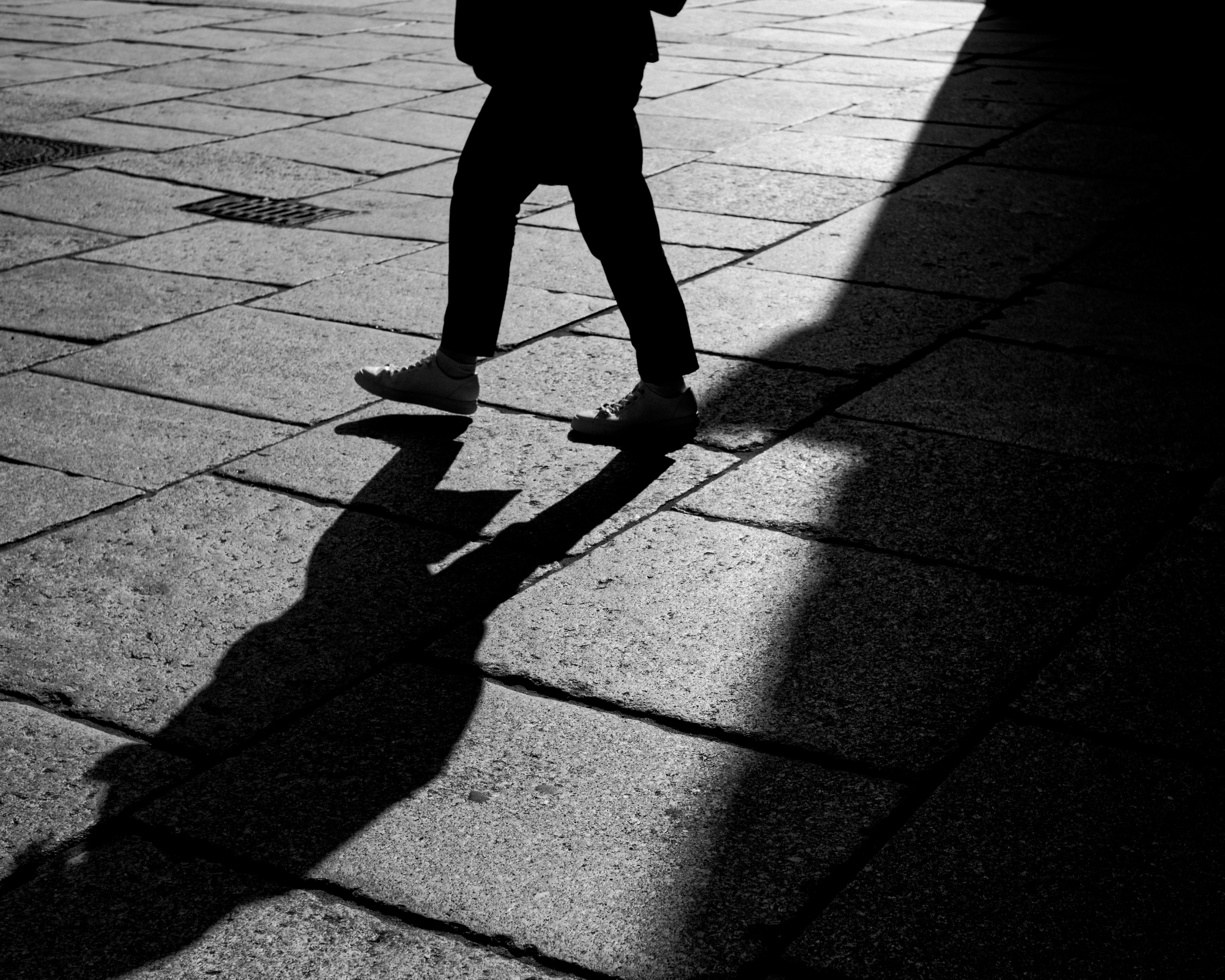Shadow of Walking Pedestrian · Free Stock Photo