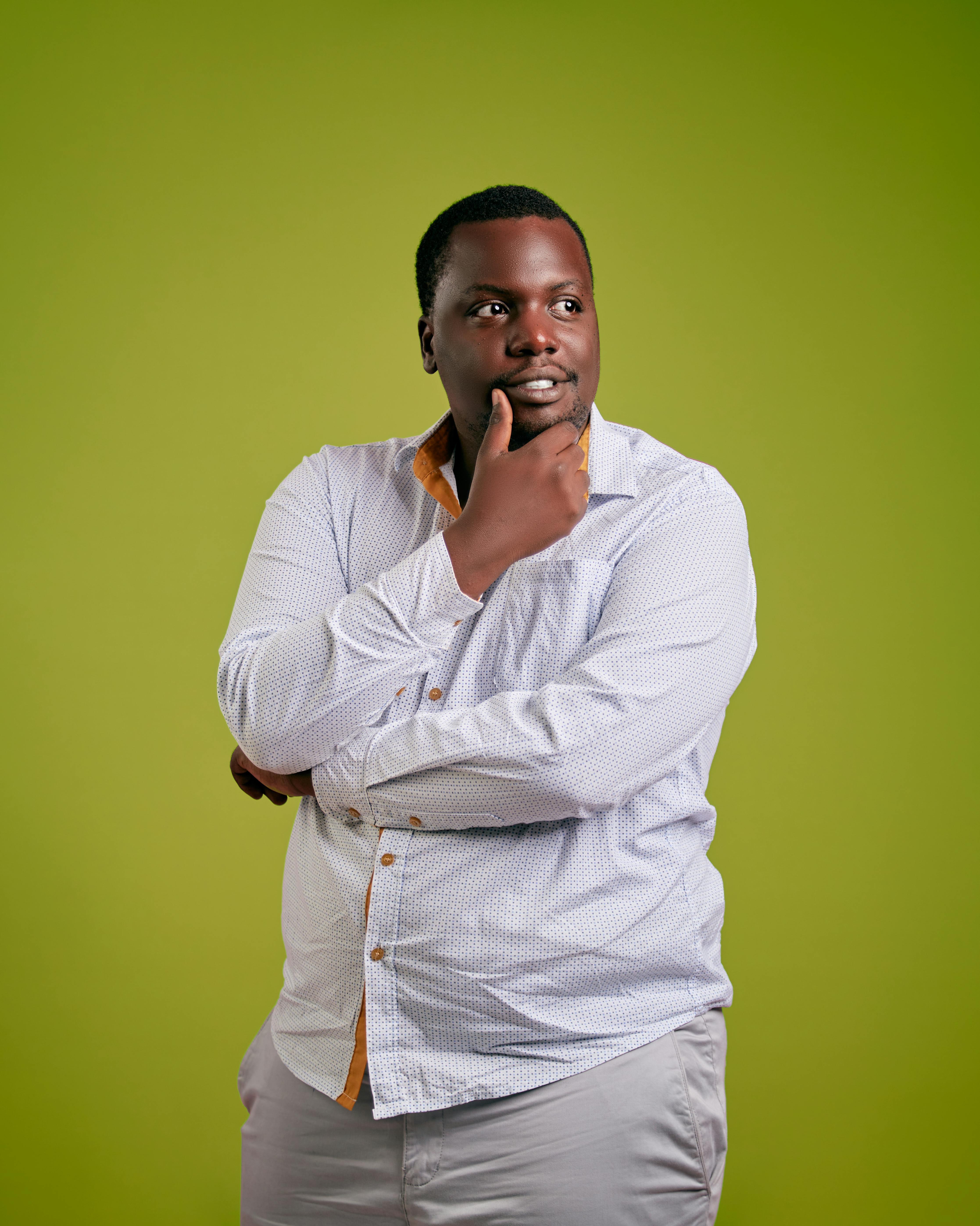 Standing Man Holding Chin · Free Stock Photo