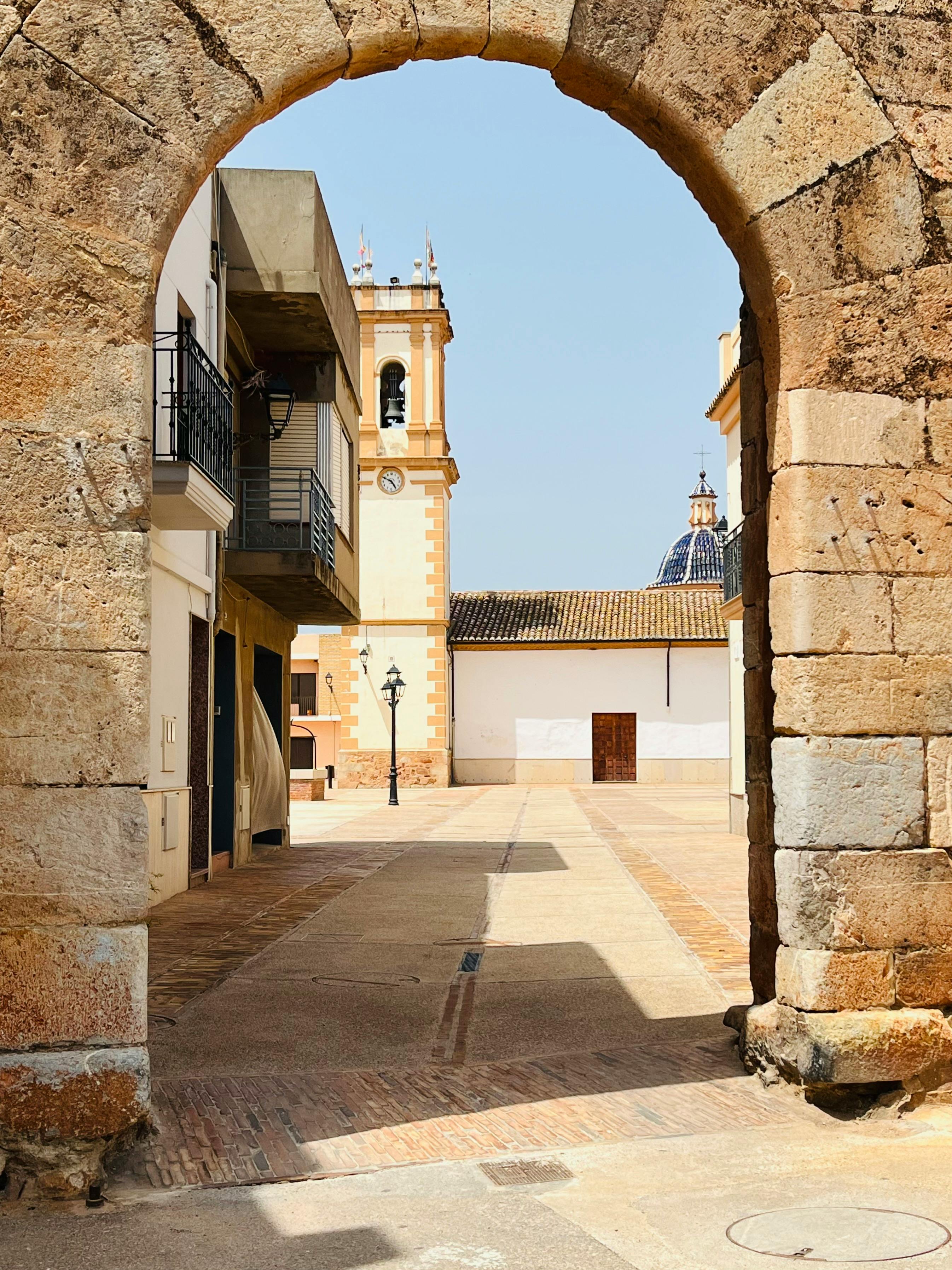 Vintage, Stone Arch and Building Tower behind · Free Stock Photo