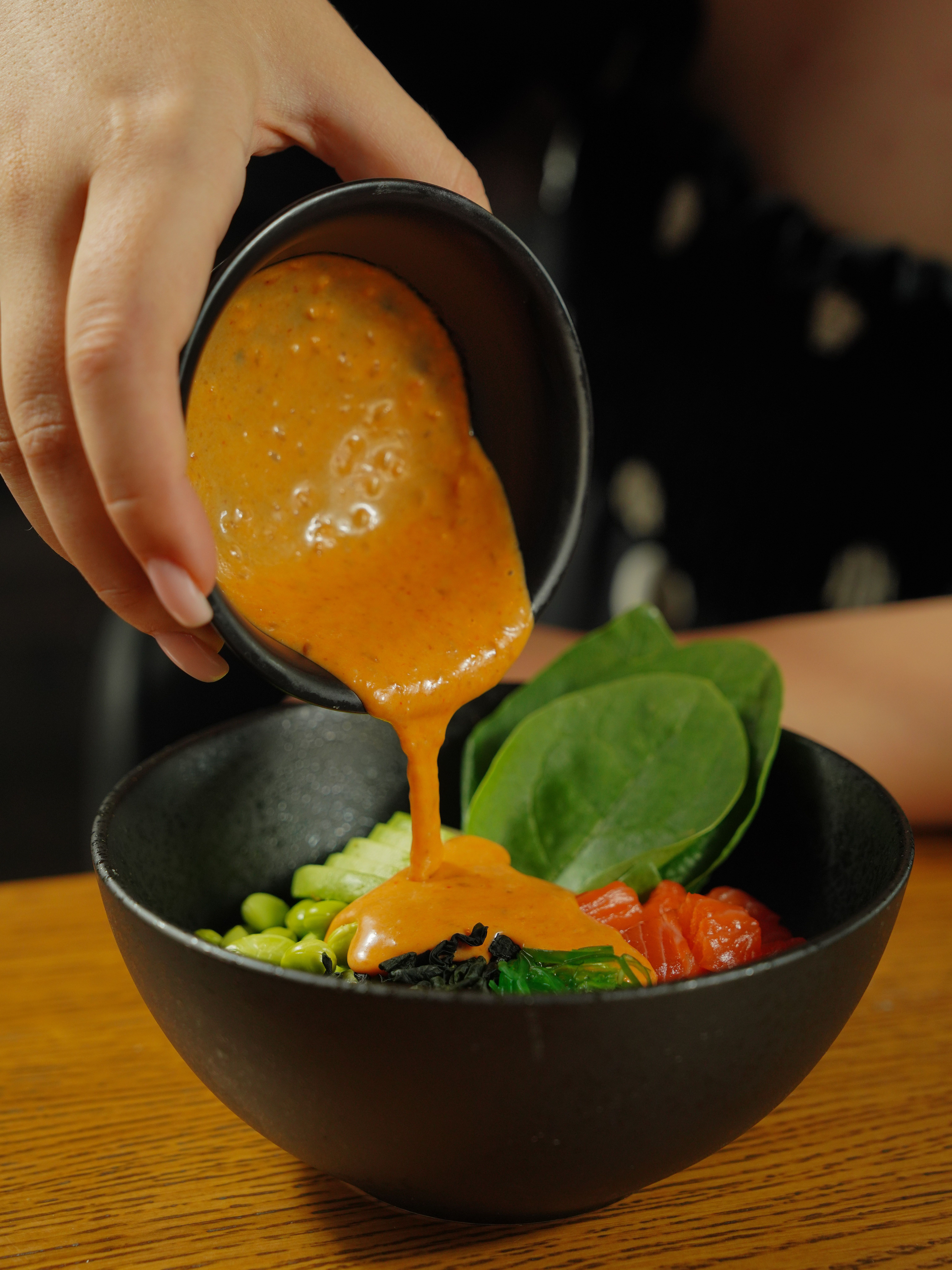 Hand Pouring Sauce to Salad · Free Stock Photo