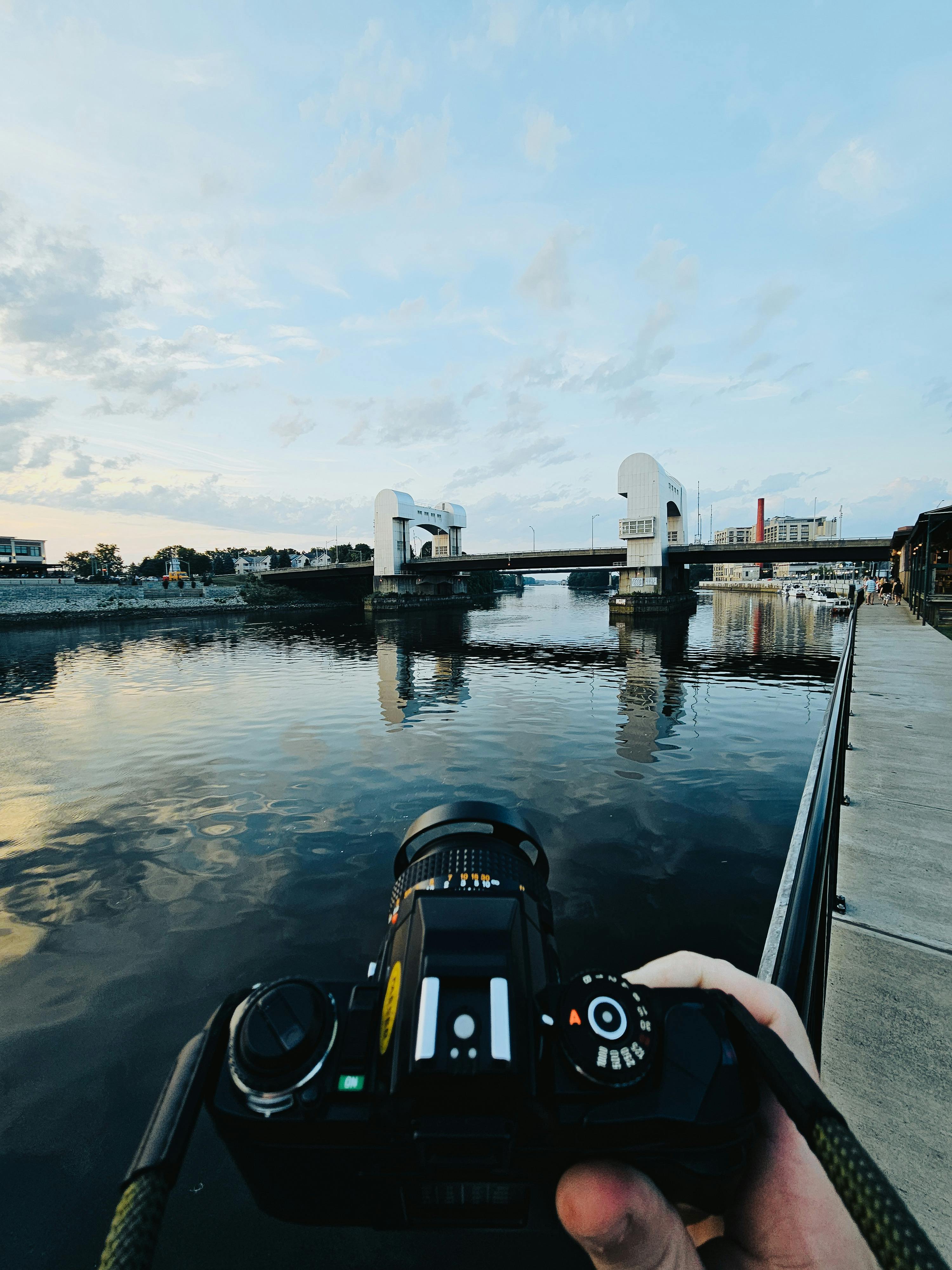 Man Aiming Analog Photo Camera at Green Island Bridge on Hudson River ...