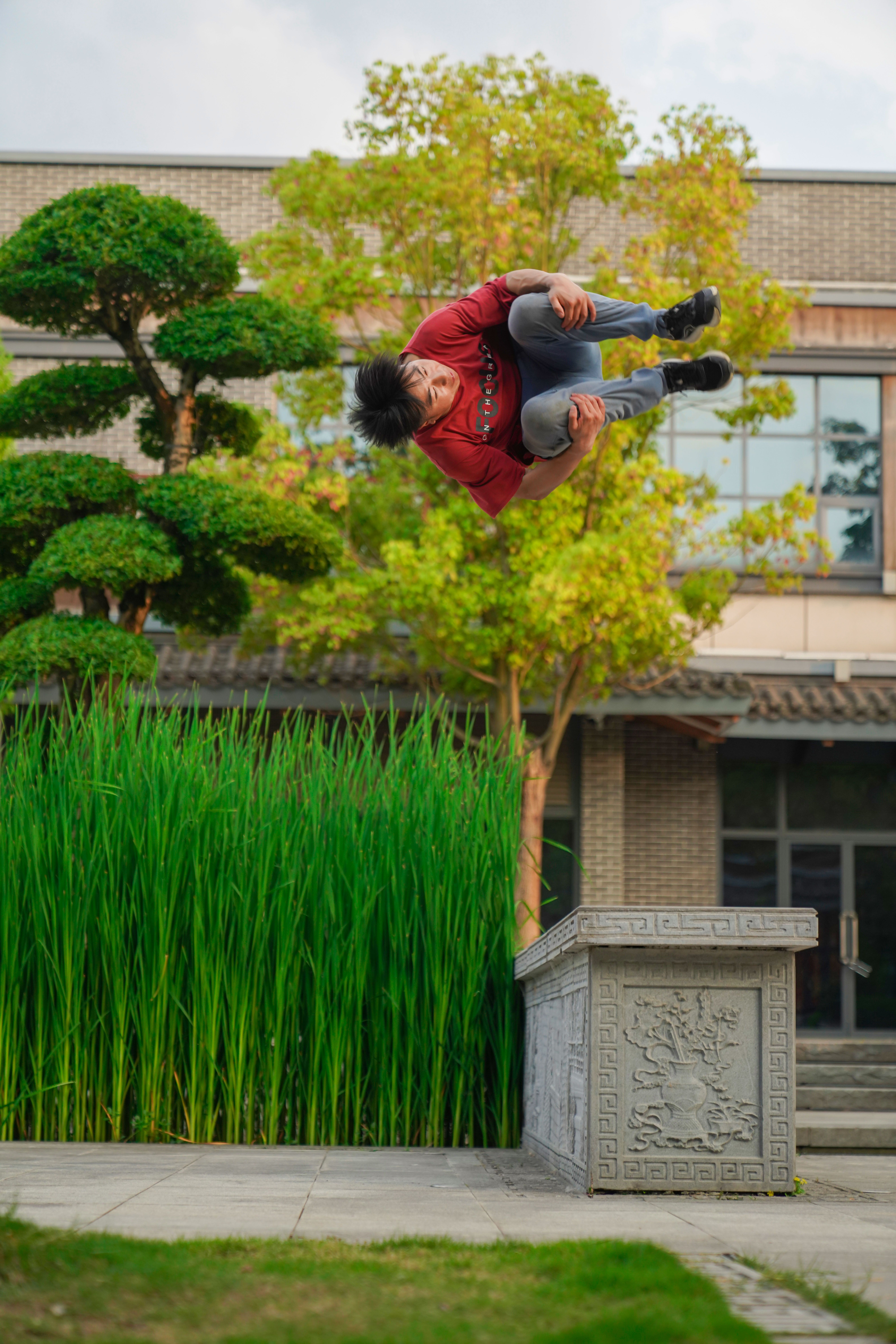 Man Doing a Flip in the Air · Free Stock Photo