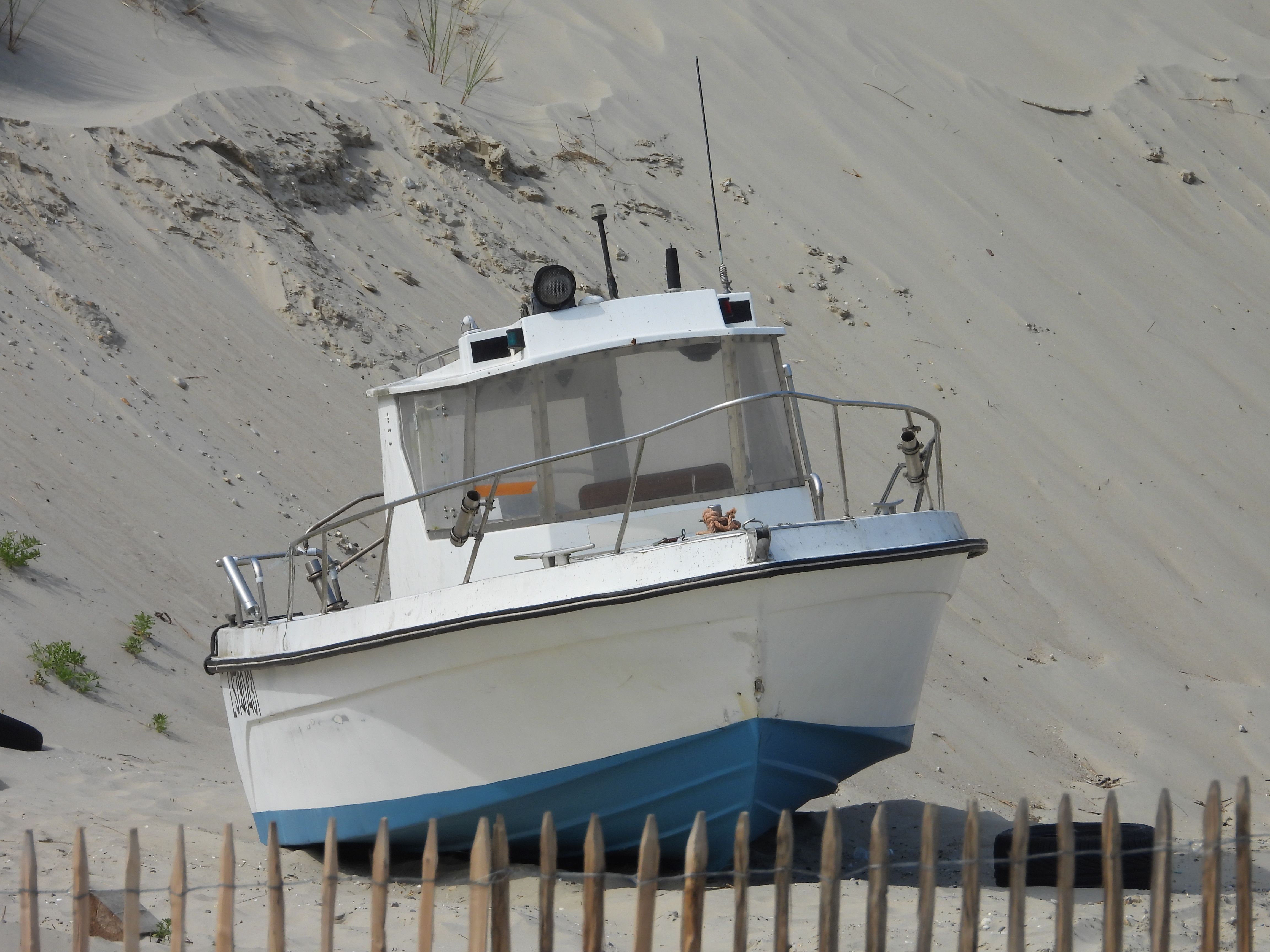 Fishing Boat Stranded on the Beach · Free Stock Photo