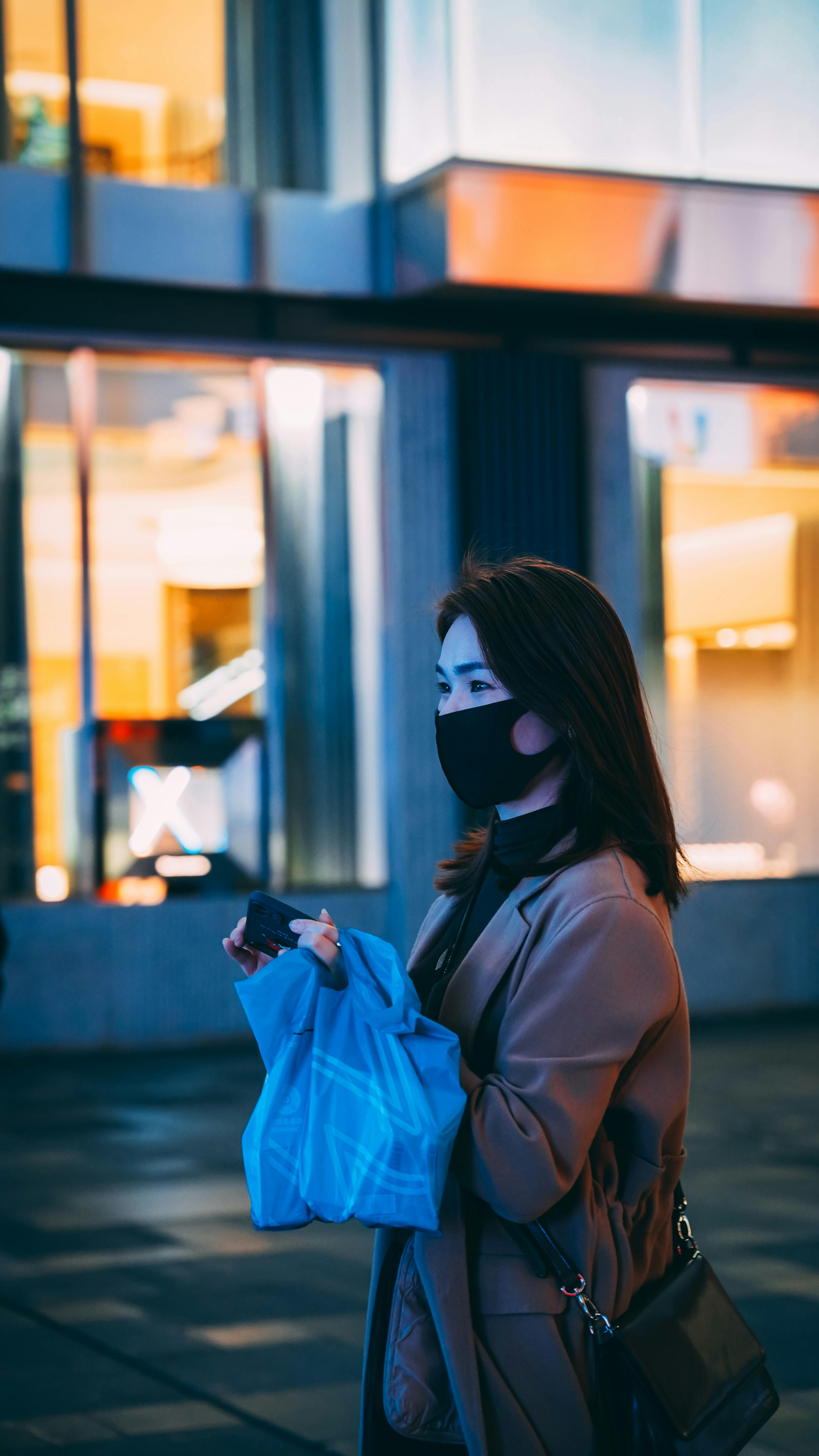 Woman in Face Mask Posing on City Street · Free Stock Photo