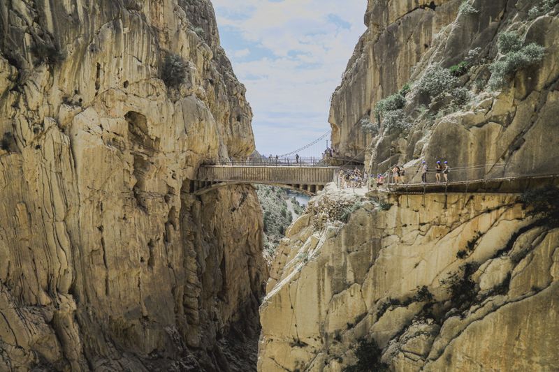 The Caminito del Rey footbridge nestled between rugged cliffs in Spain mountains