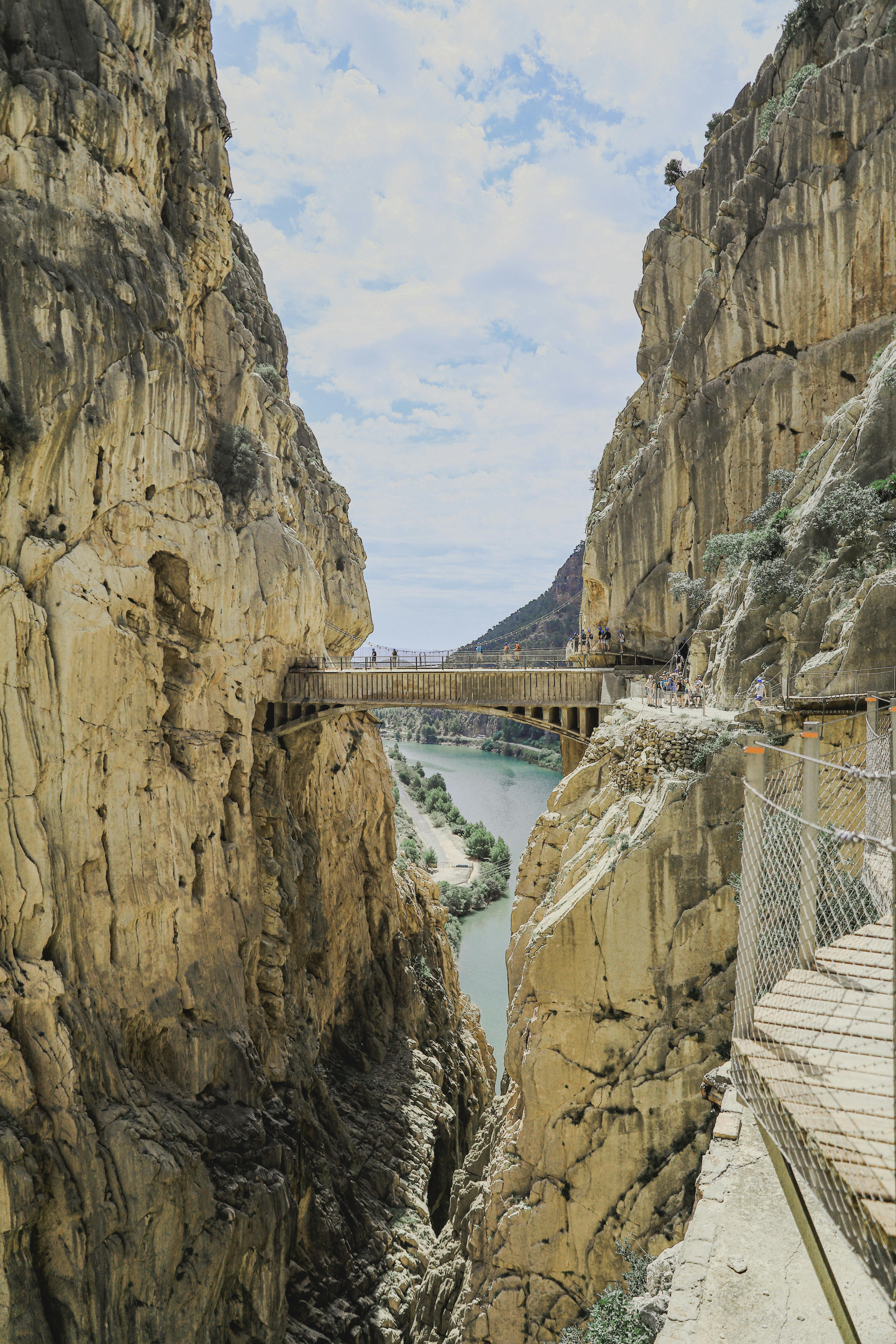 A bridge over a canyon with a view of the mountains · Free Stock Photo