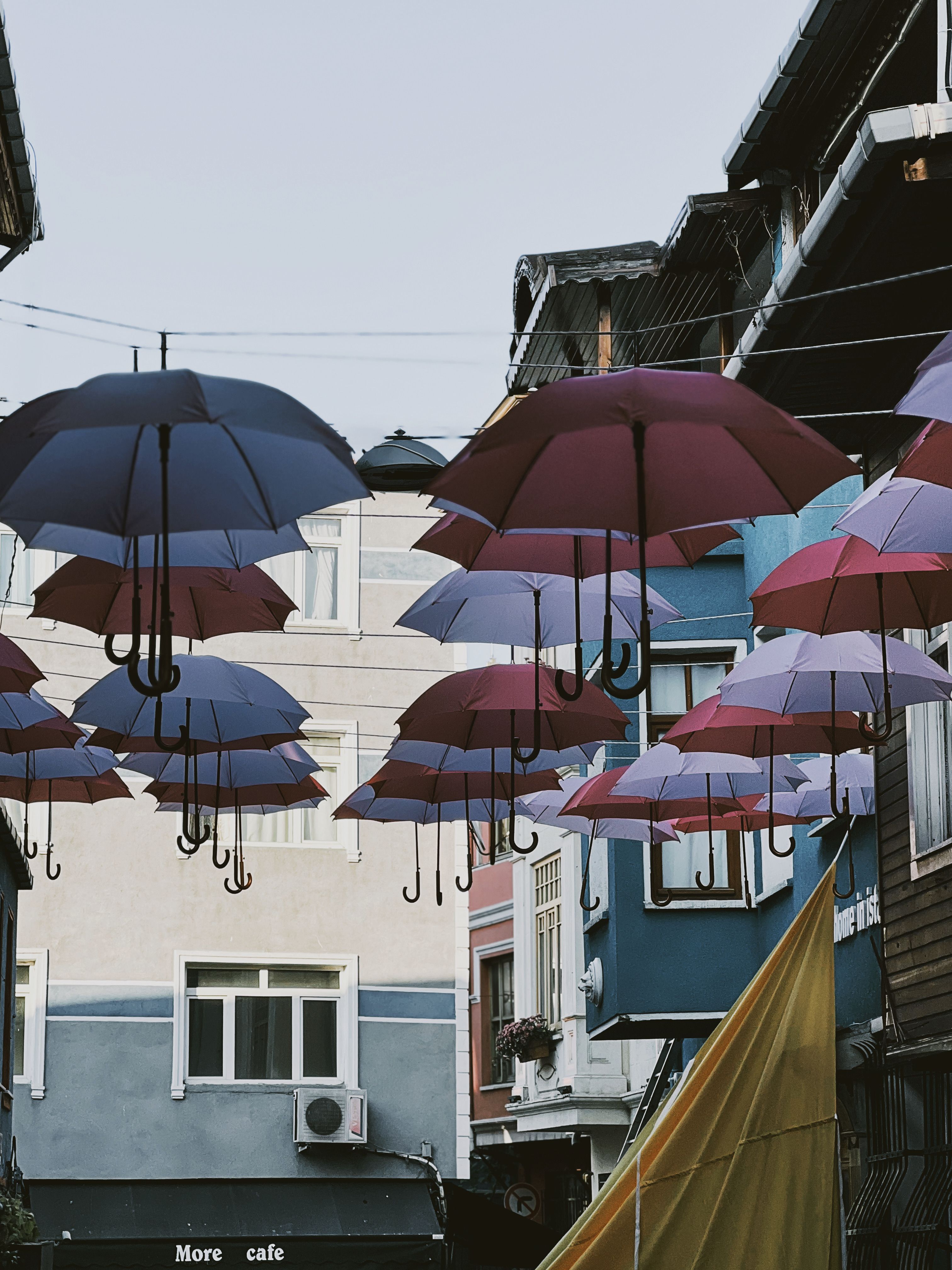 Photo of People Between Buildings · Free Stock Photo