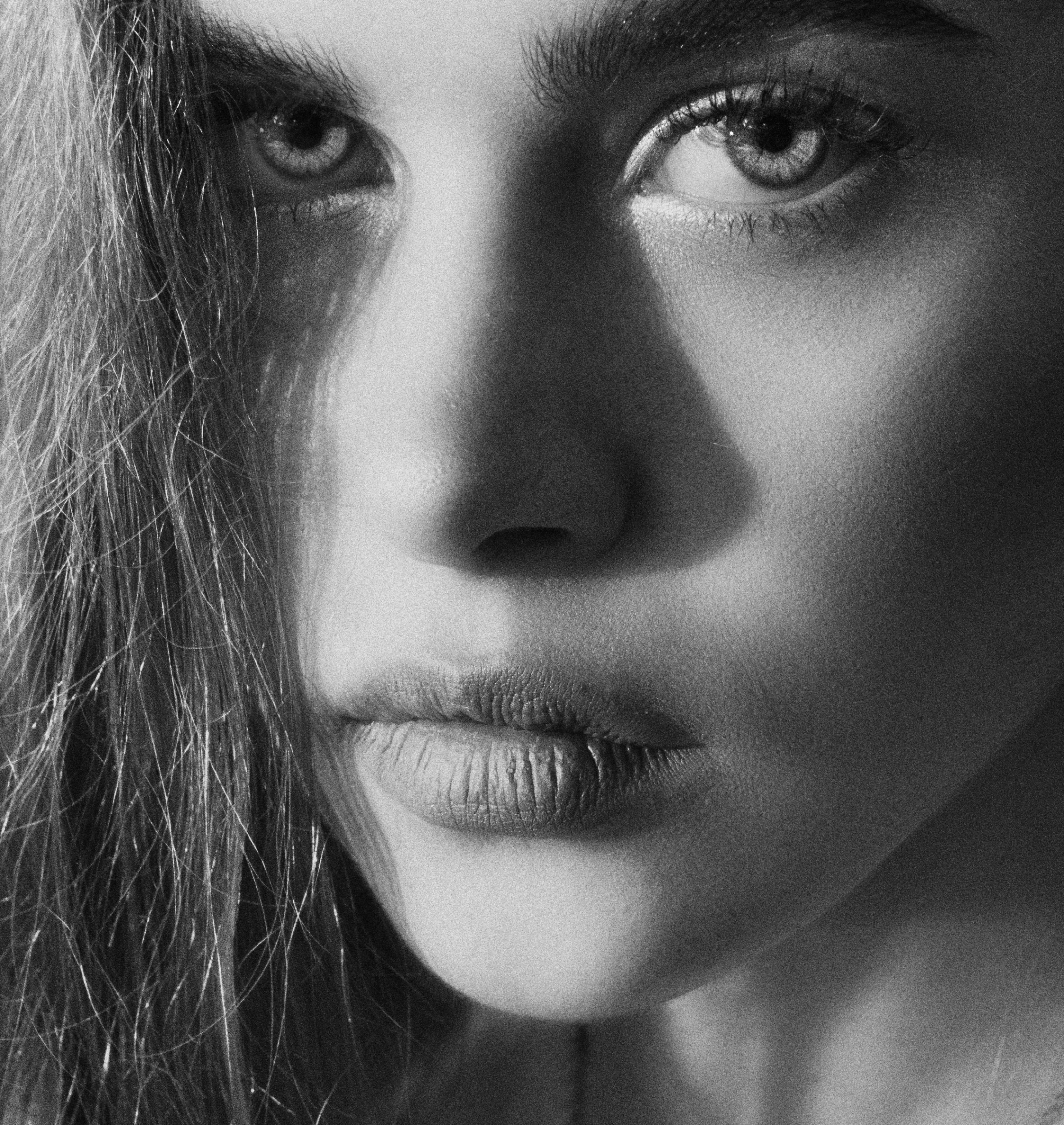 Close-up of a Womans Face in Grayscale · Free Stock Photo