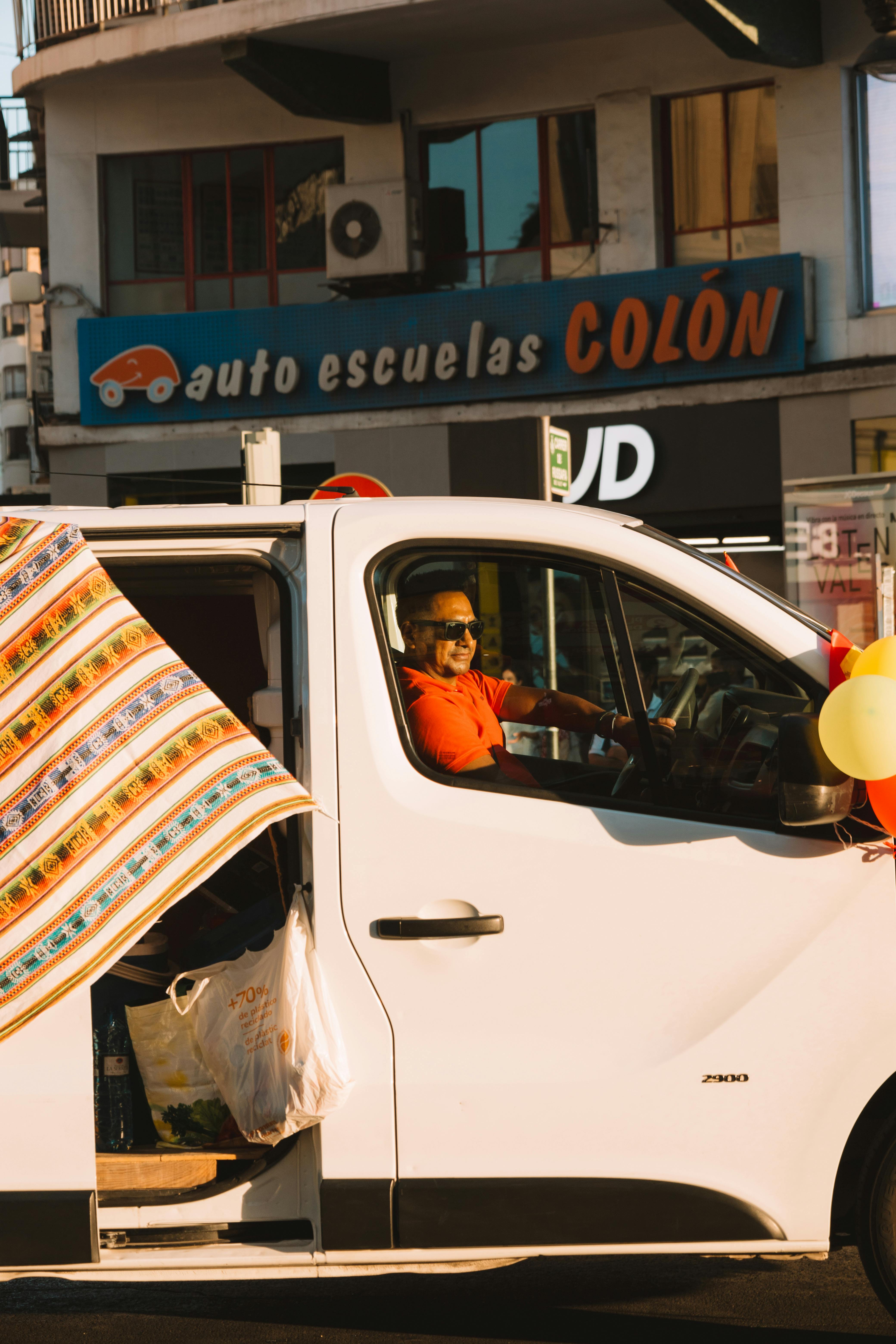 Man Driving White Van · Free Stock Photo