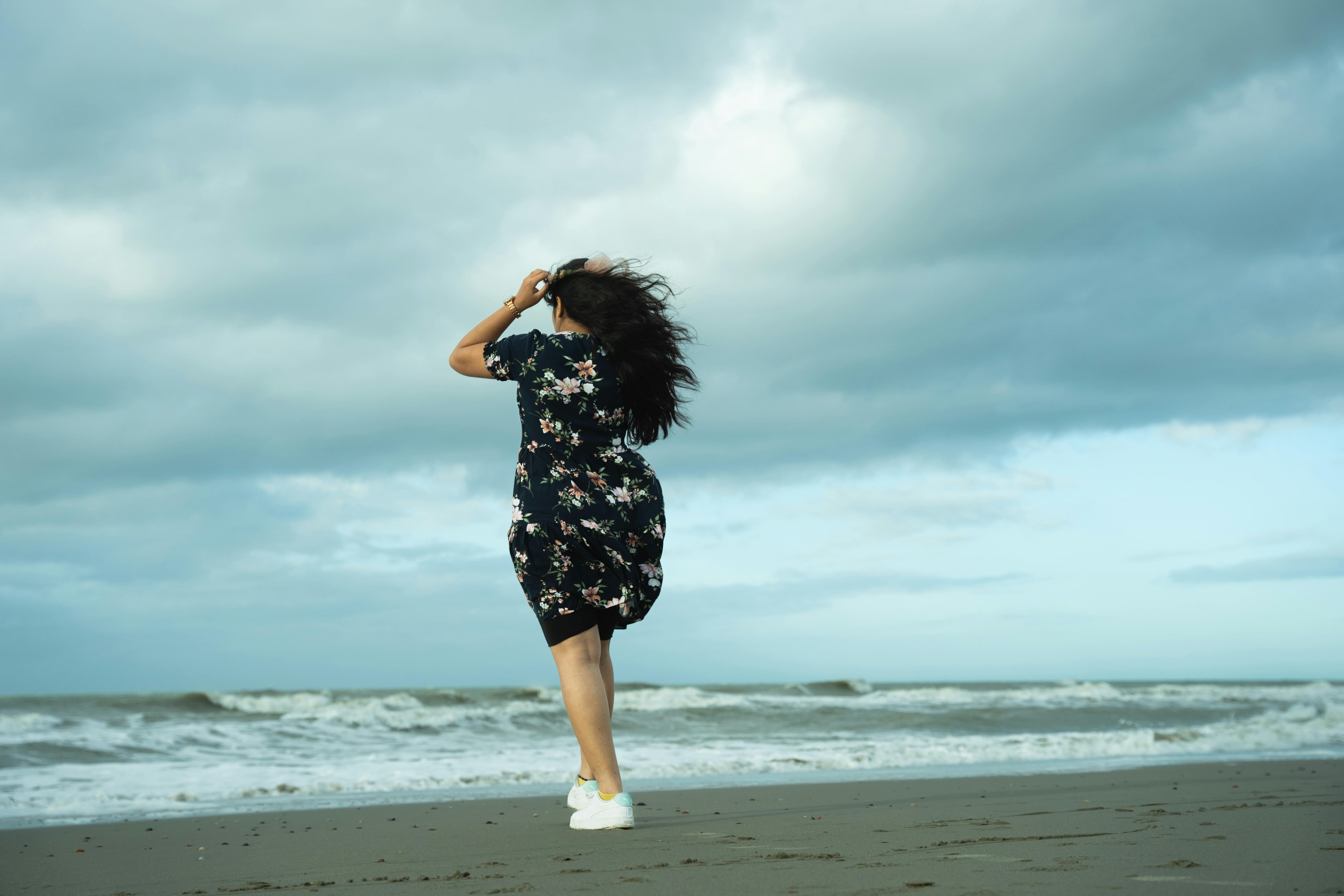 Man Standing on Sea Shore · Free Stock Photo