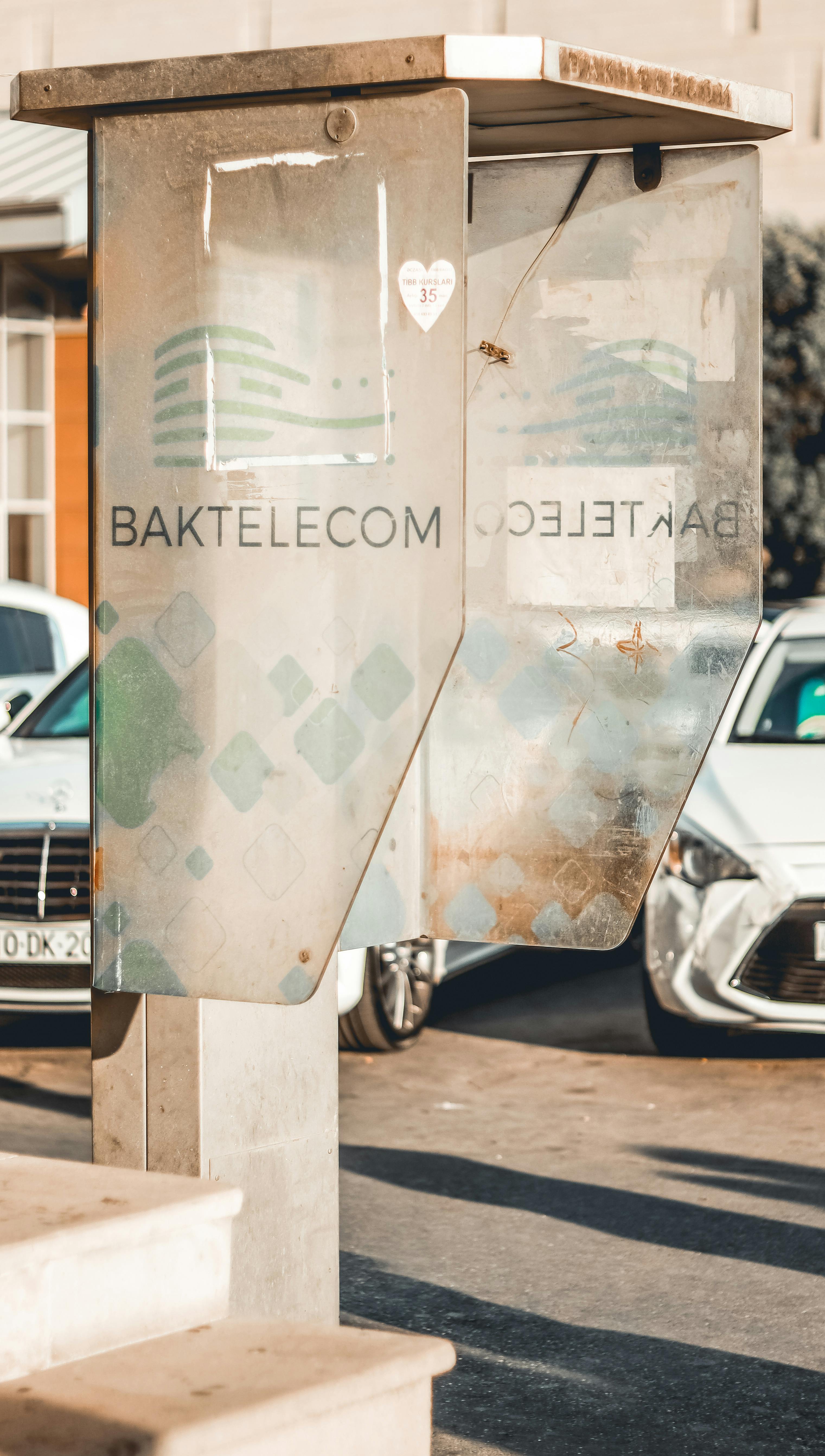 Red Payphone Attached to a Wall · Free Stock Photo