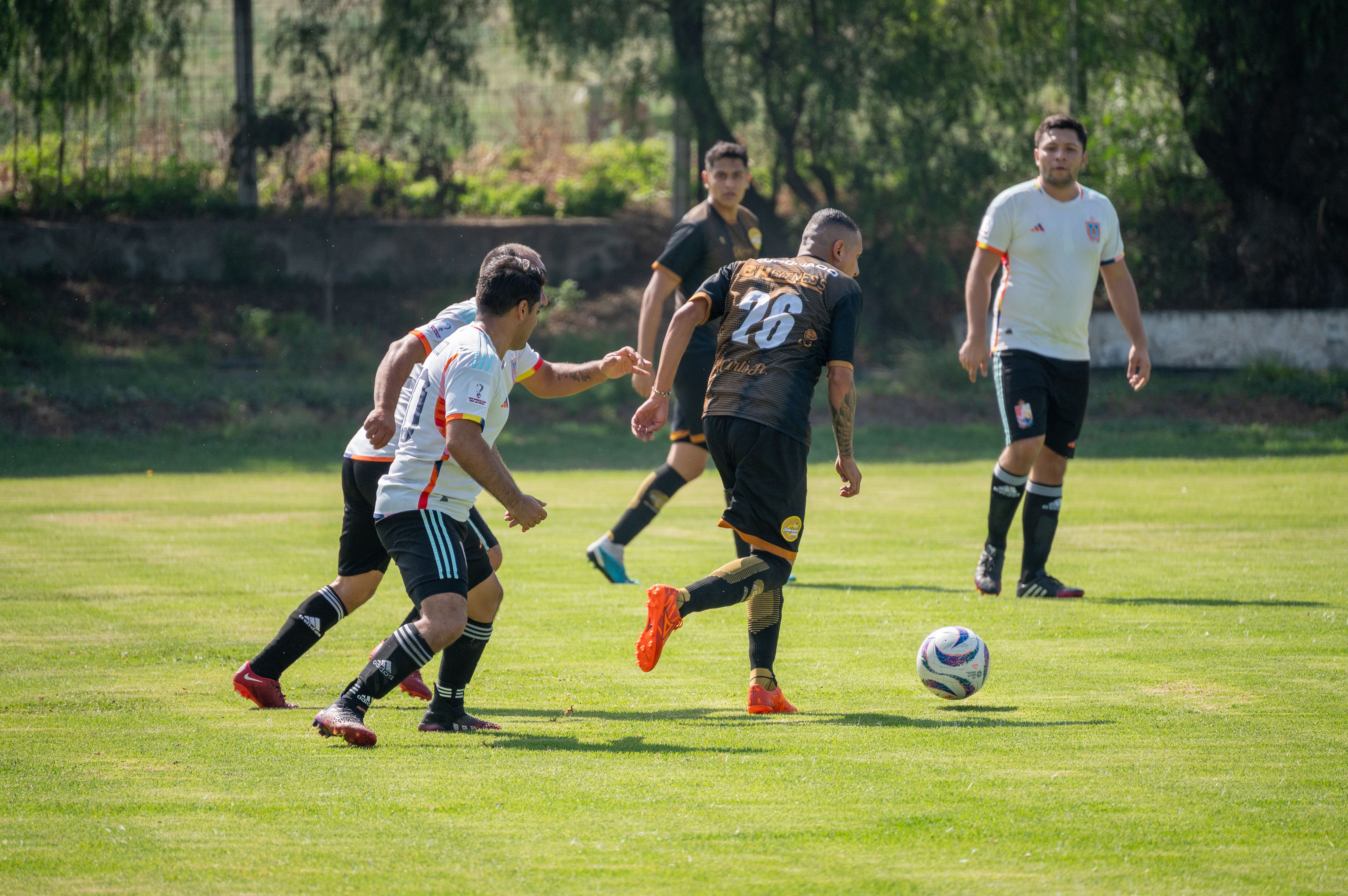 Men Playing Football on Field · Free Stock Photo