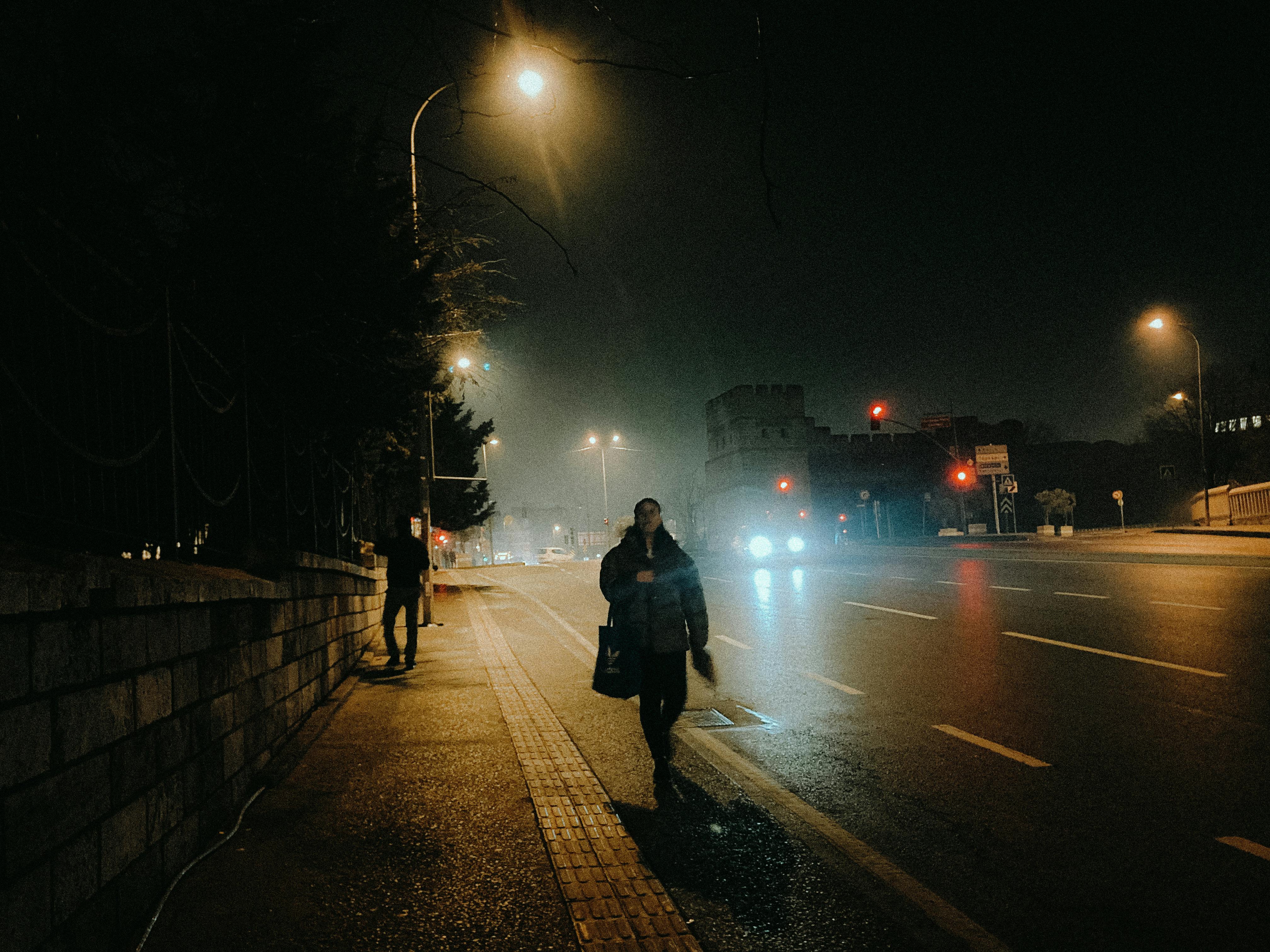 Man Walking in City at Night · Free Stock Photo