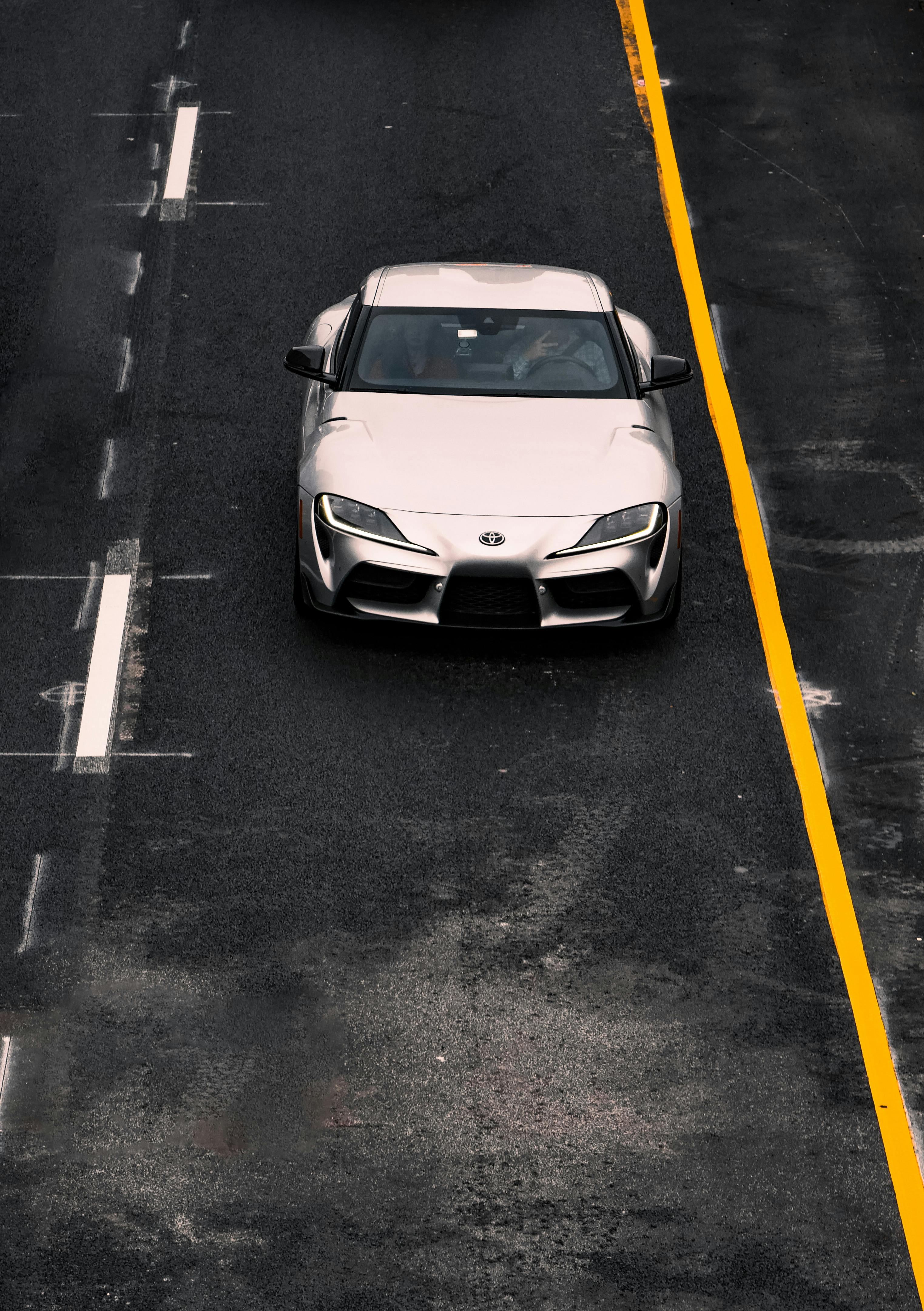 Silver Toyota Supra Parked on Sidewalk · Free Stock Photo