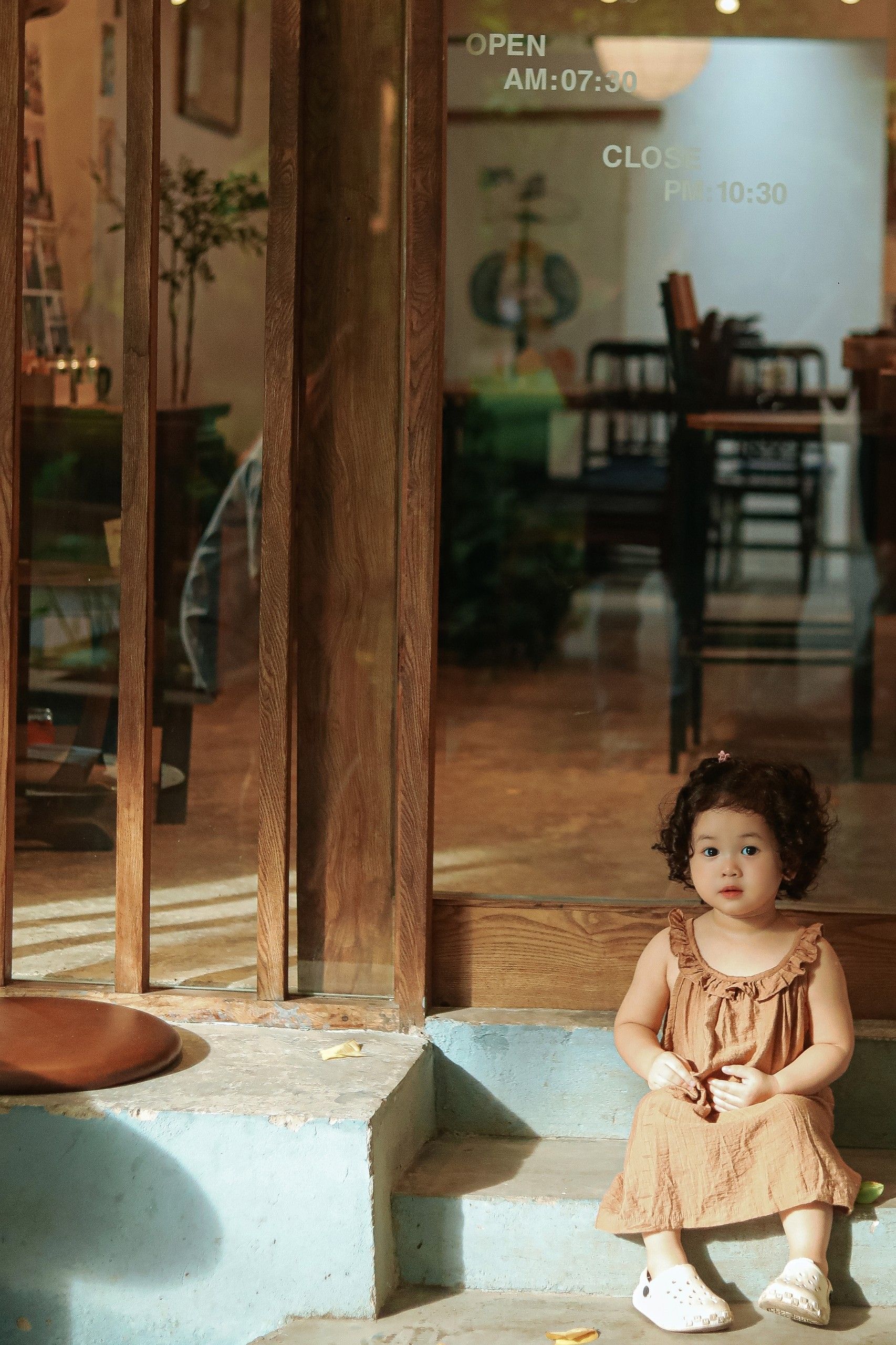 Cute Child Sitting in Front of the Window · Free Stock Photo