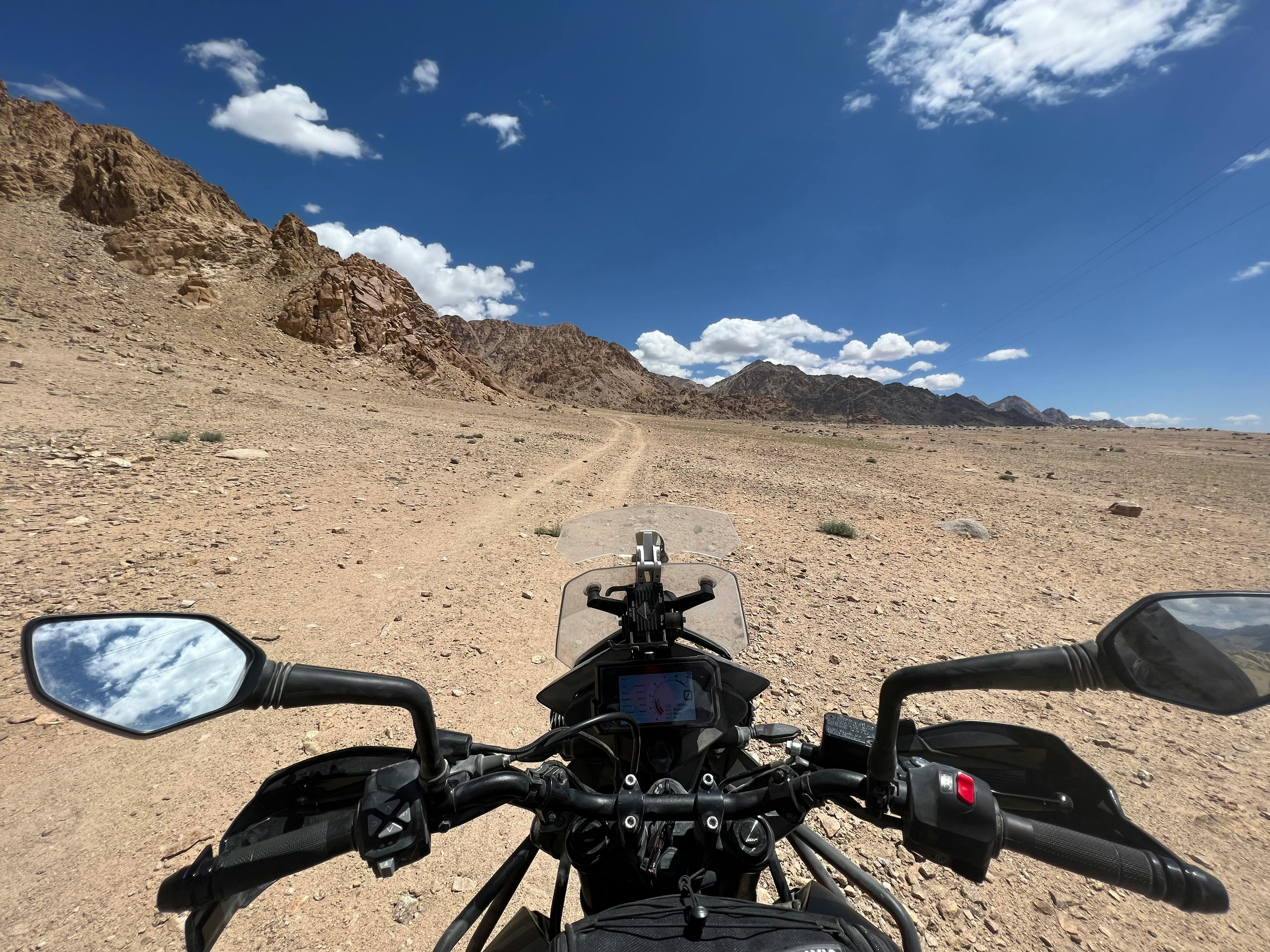 Handlebars of Quad on Dirt Road · Free Stock Photo