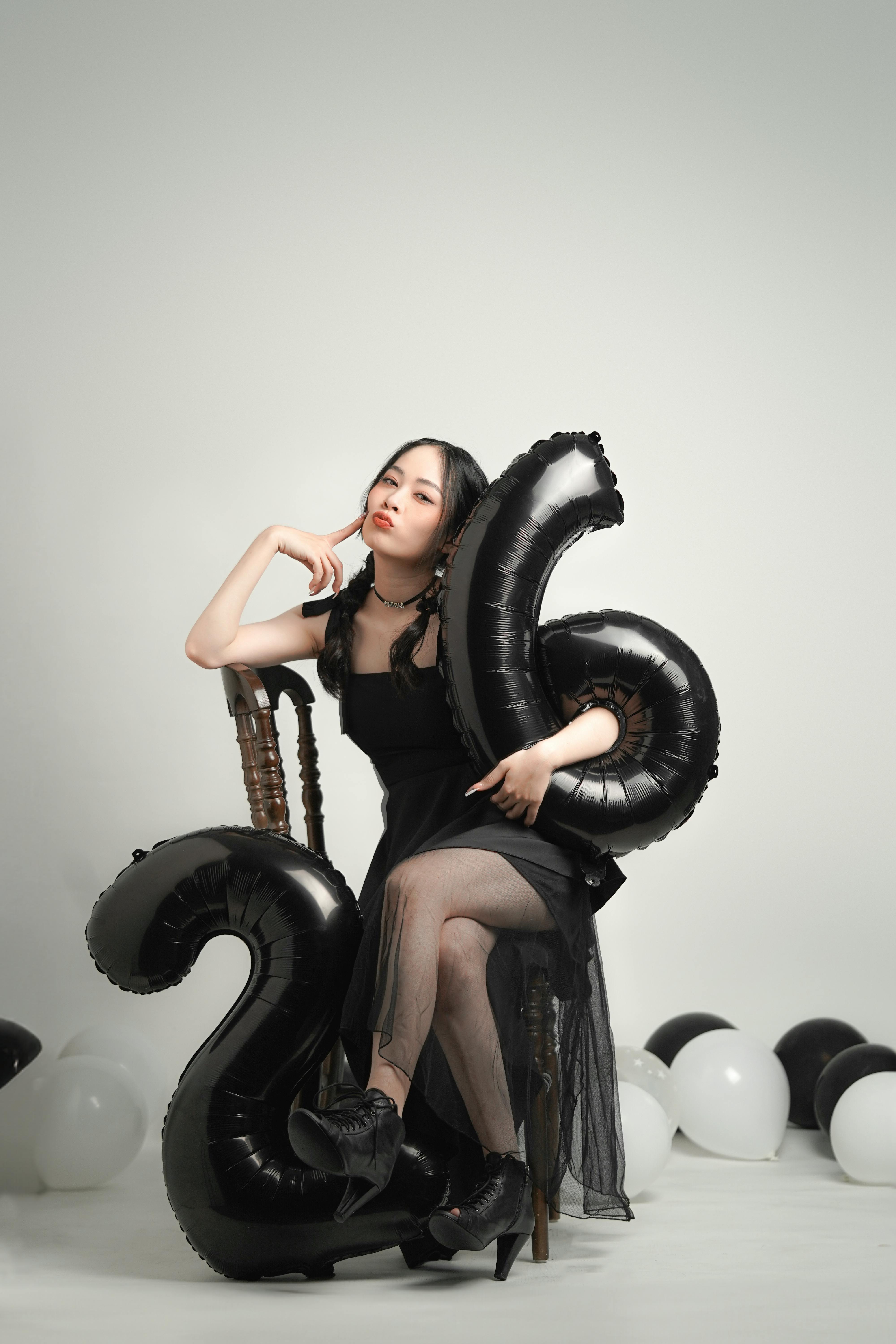 Woman Holding Birthday Balloons · Free Stock Photo