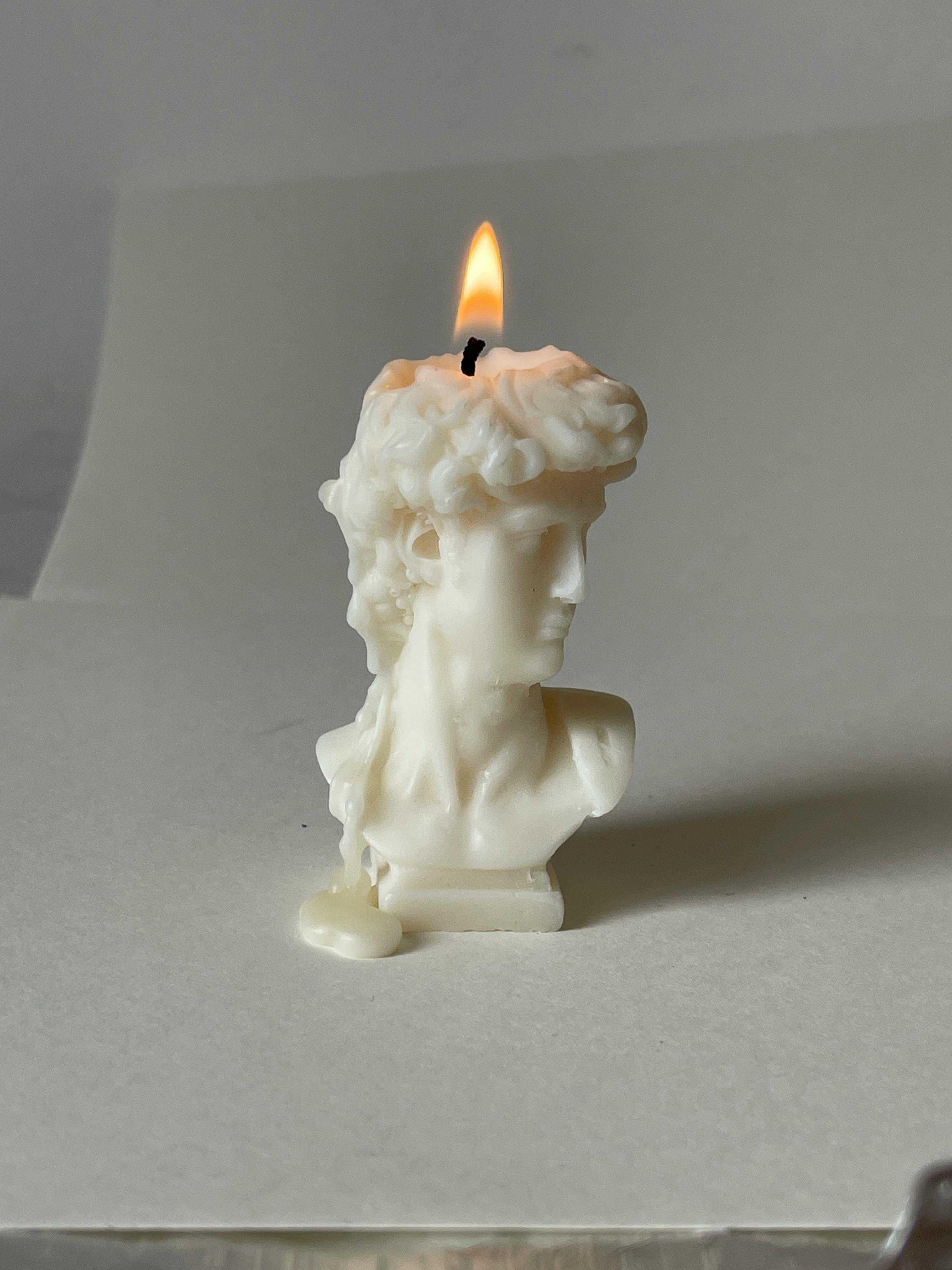 A Candle in a Shape of a Statue of a Man · Free Stock Photo