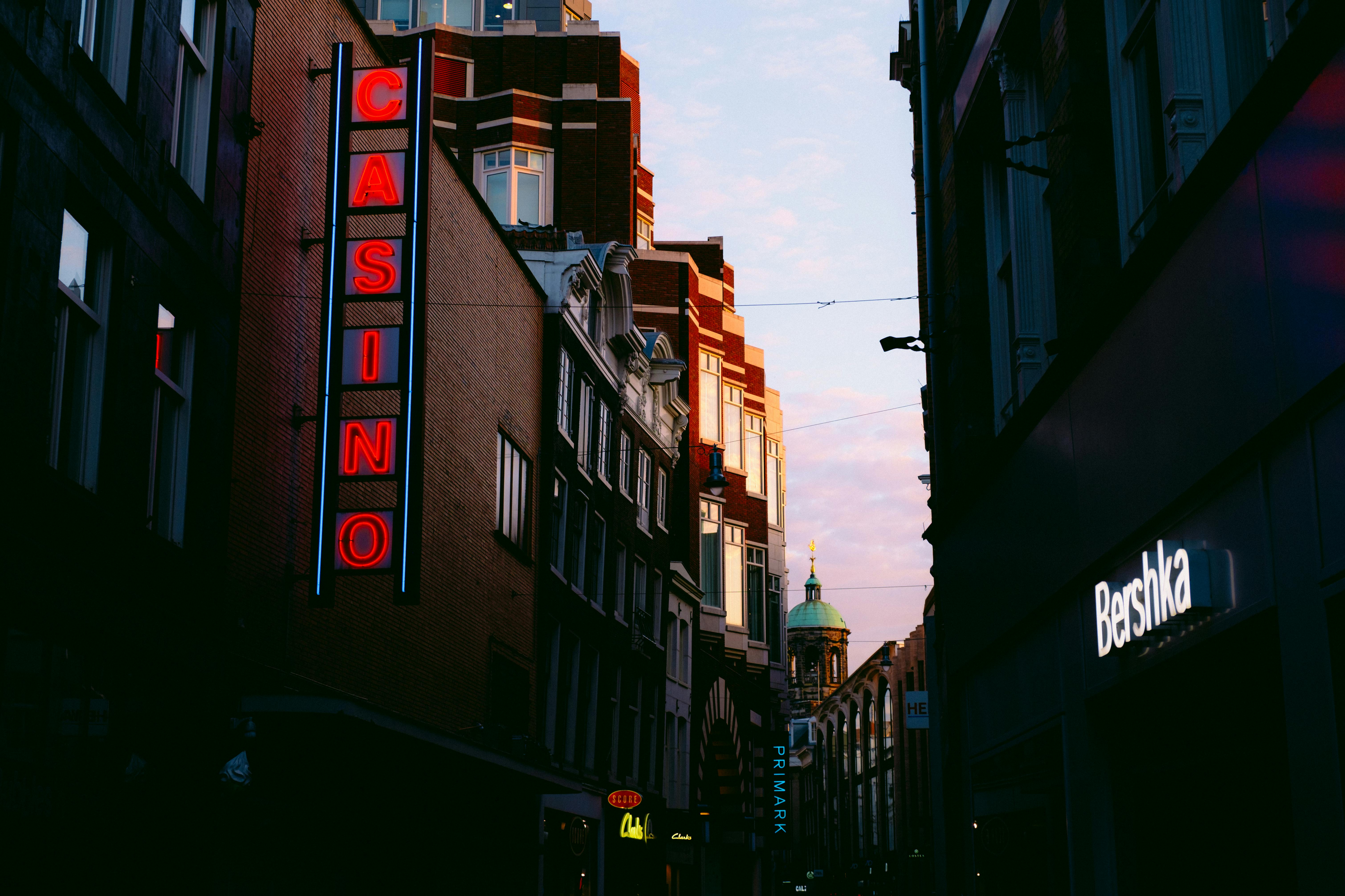 Neon Light Sign on the Side of a Building · Free Stock Photo