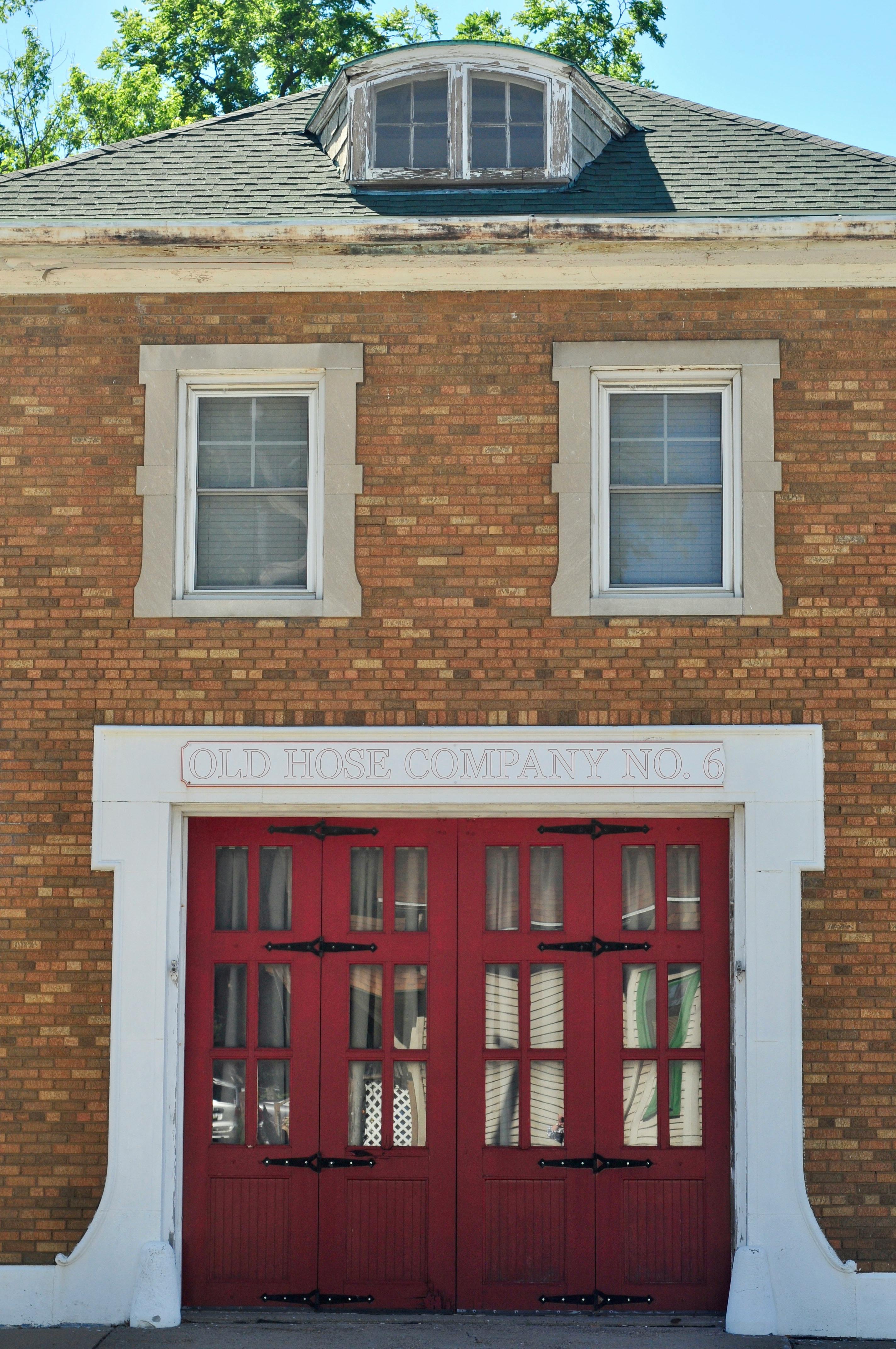 Red Door in a Brick Building · Free Stock Photo