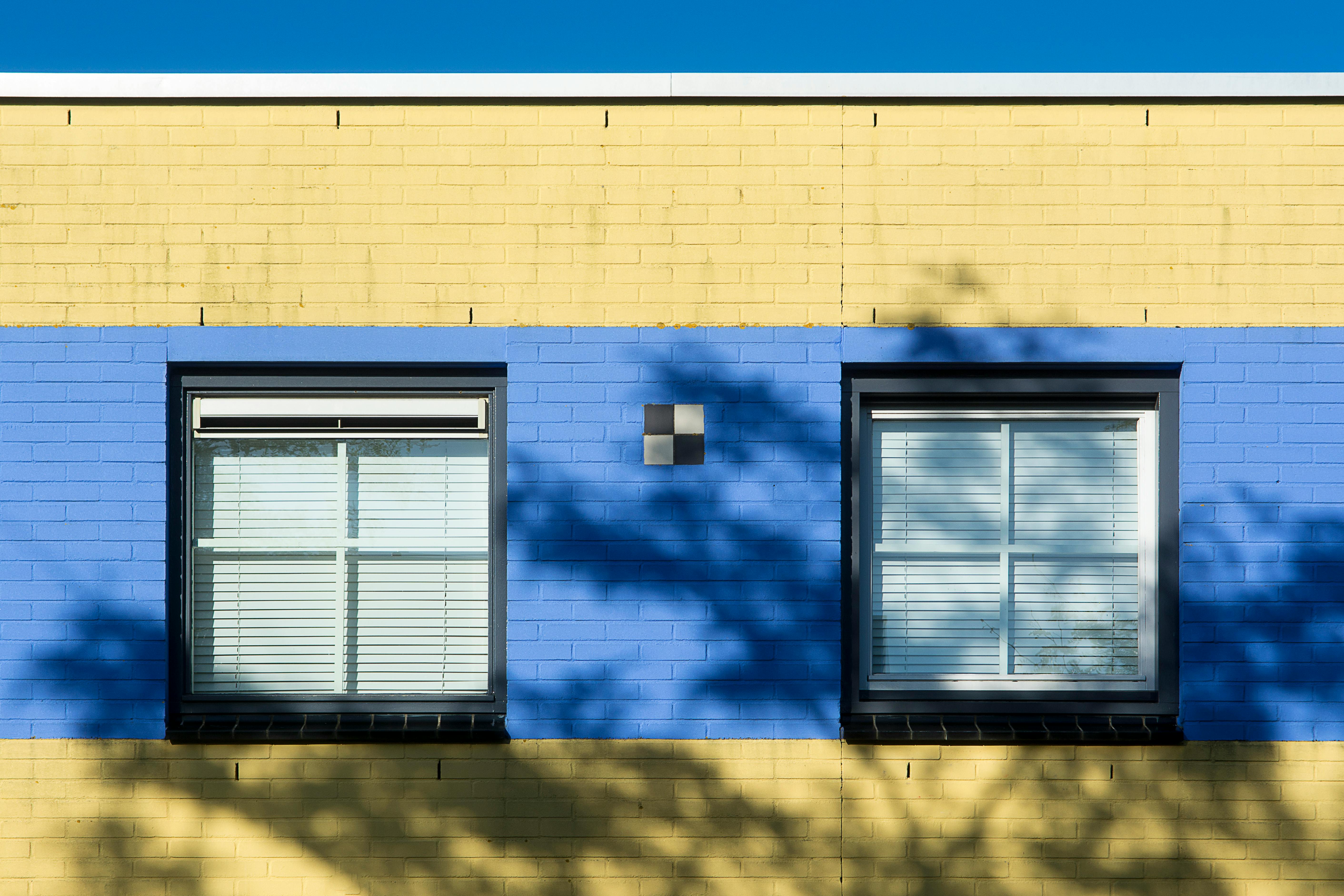 Blue and Yellow Wall of Building · Free Stock Photo