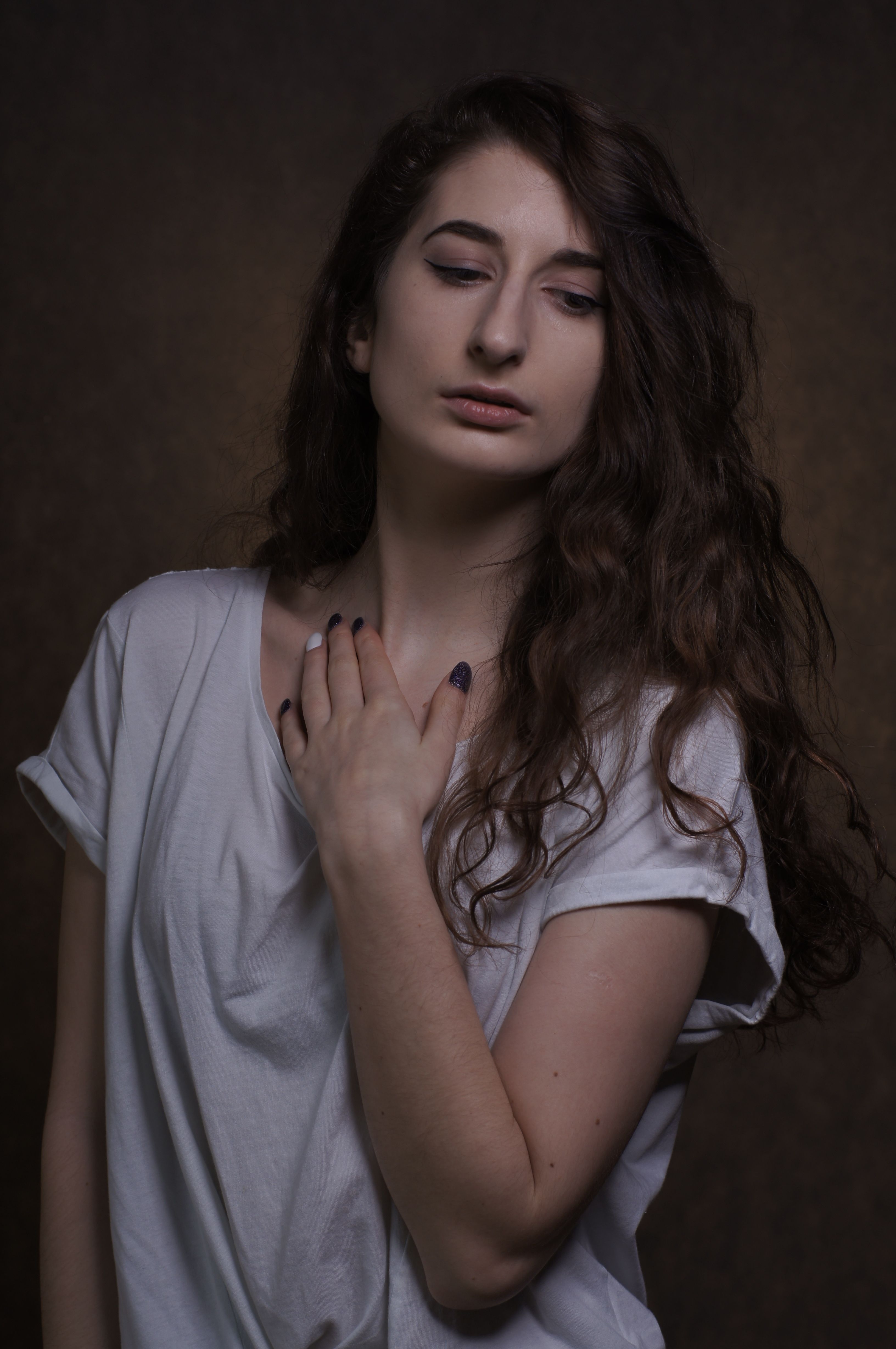 Brunette Woman Holding Hand on Neck · Free Stock Photo